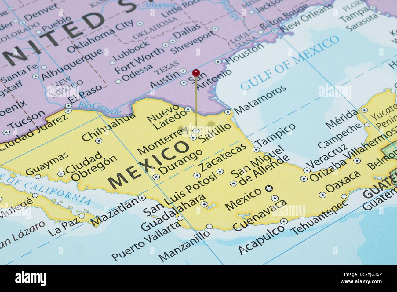 Close up to a Monterrey city with a red pin needle into Mexico country ...