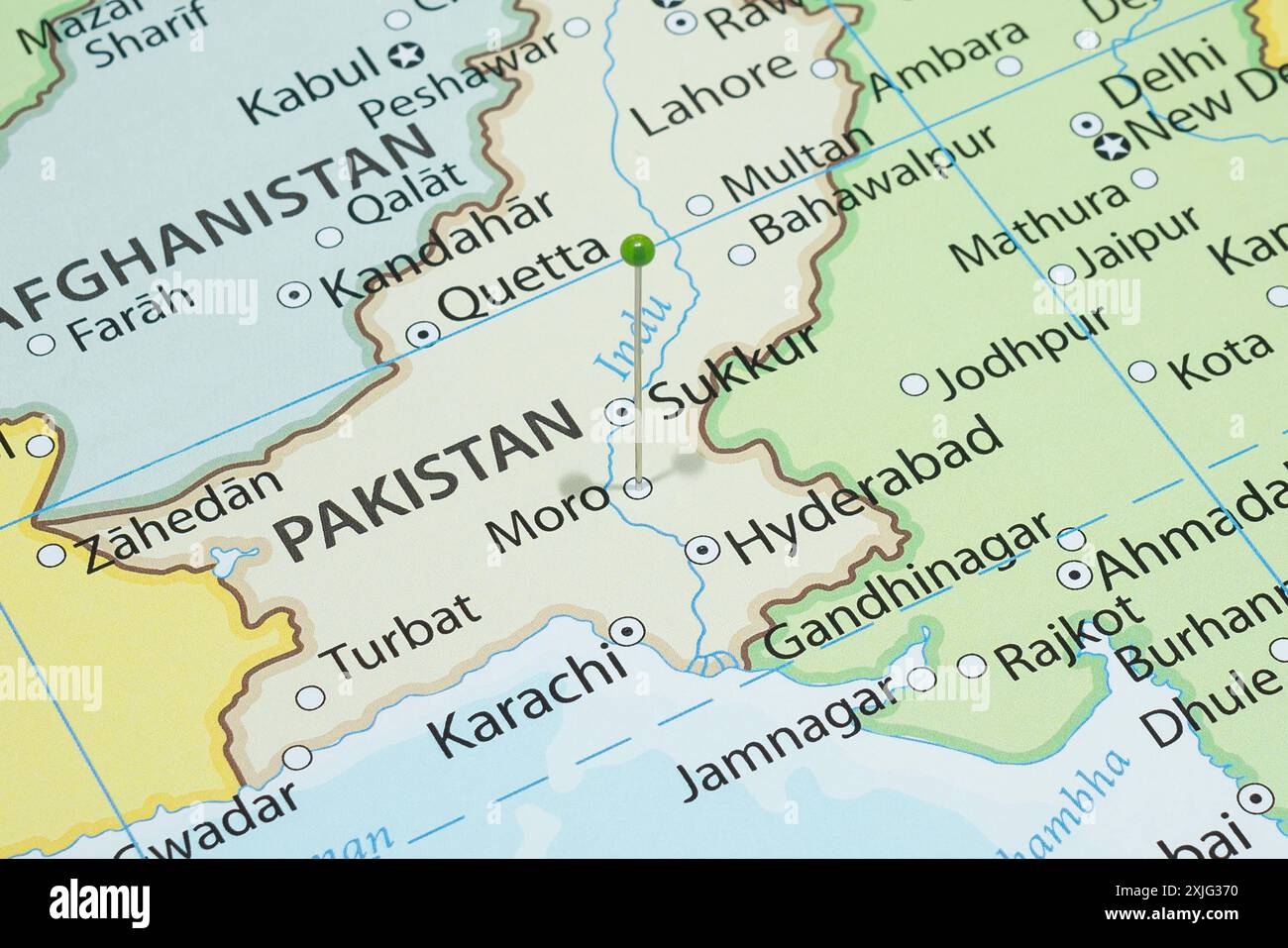 Close up to a Moro city with a green pin needle into Pakistan country ...