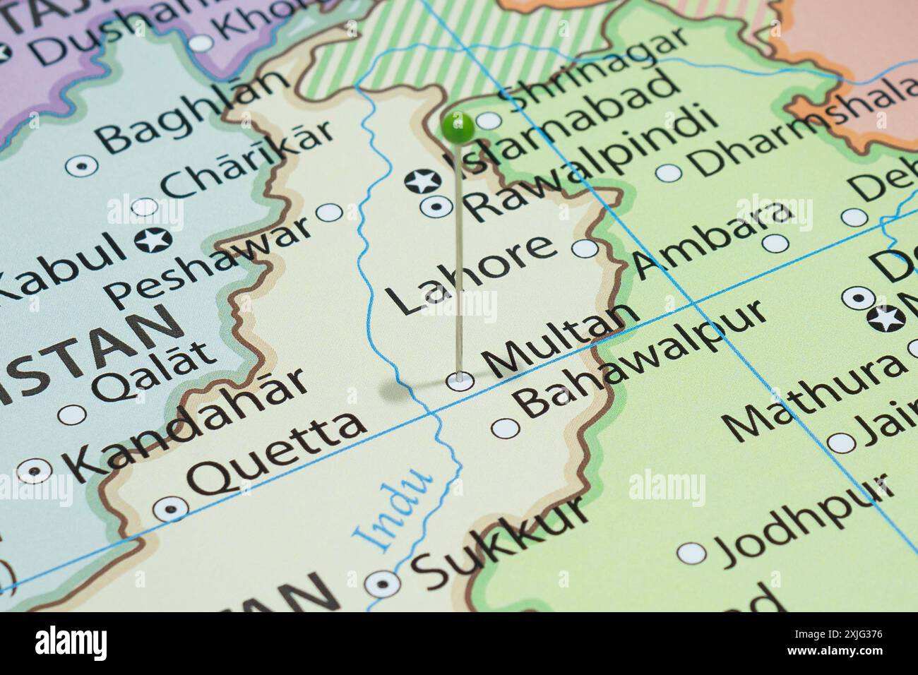 Close up to a Multan city with a green pin needle into Pakistan country ...