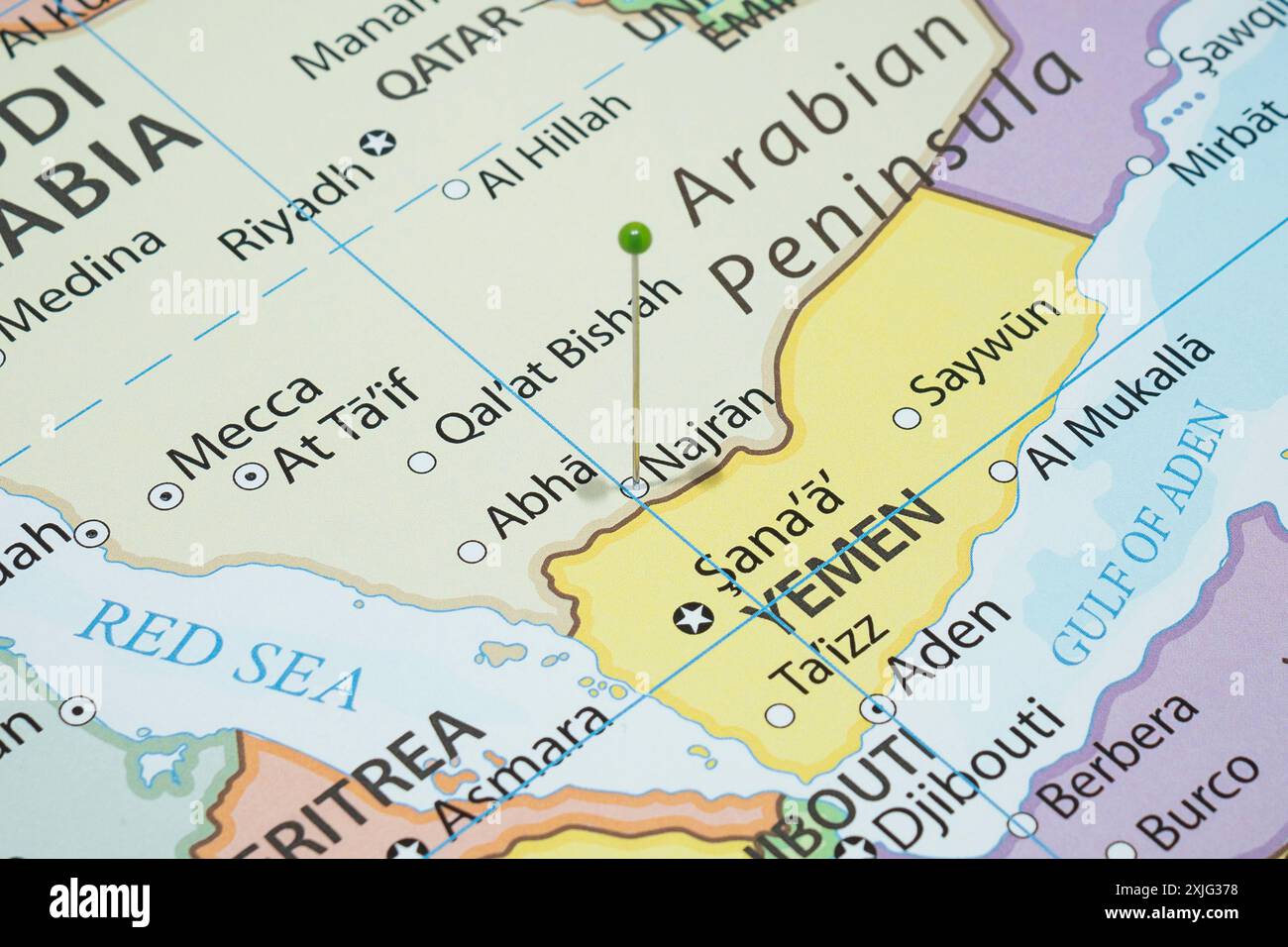 Close up to a Najran city with a green pin needle into Saudi Arabia ...