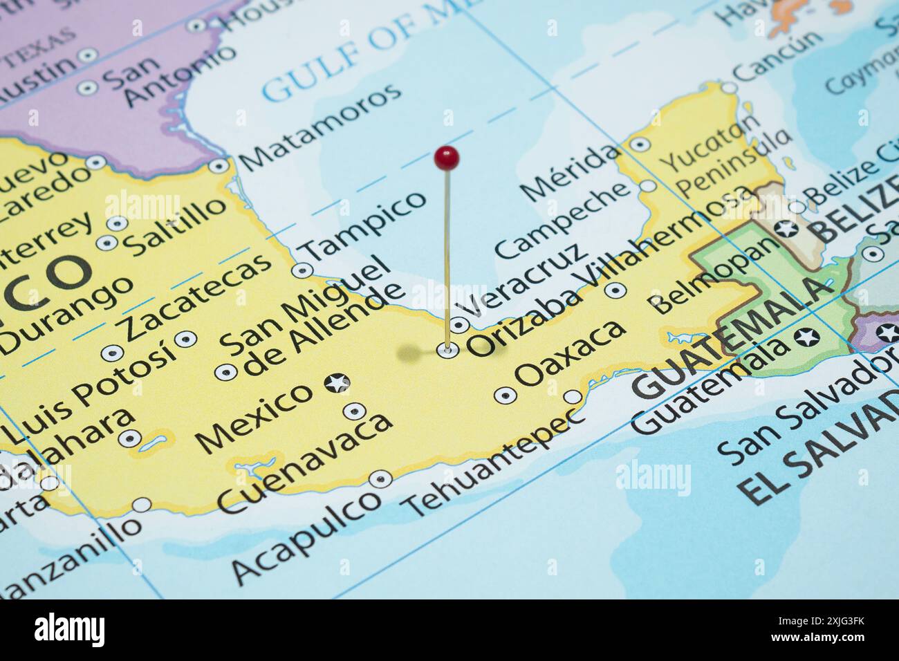 Close up to a Orizaba city with a red pin needle into Mexico country ...