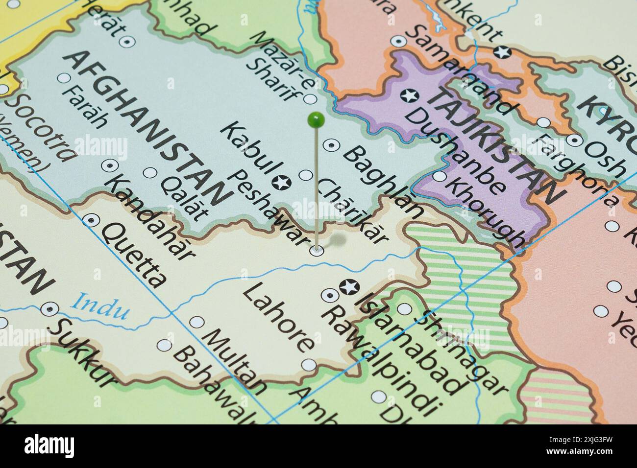 Close up to a Peshawar city with a green pin needle into Pakistan ...