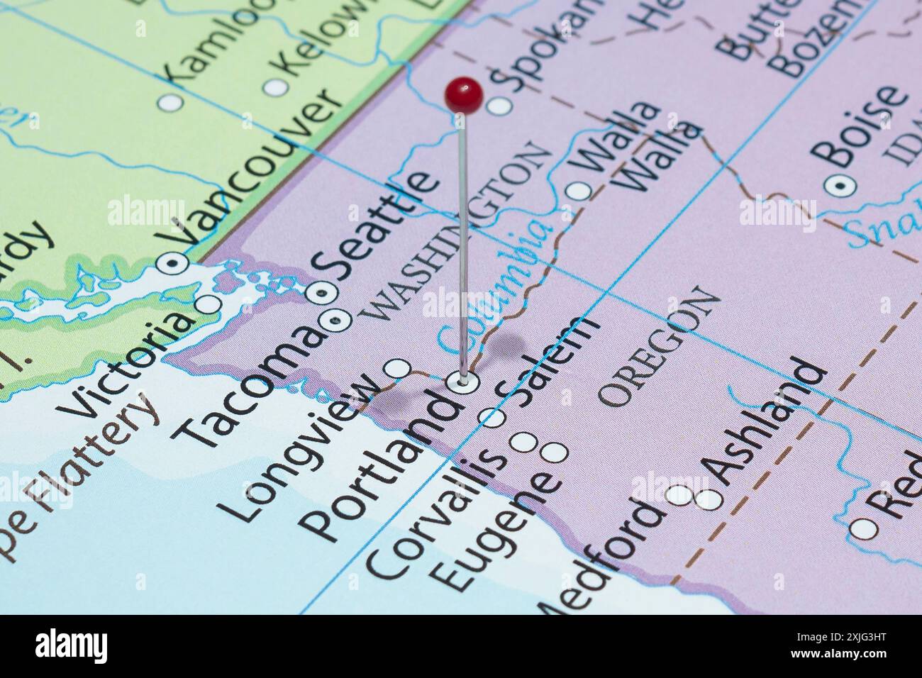 Close up to a Portland city with a red pin needle into Orengon state of ...