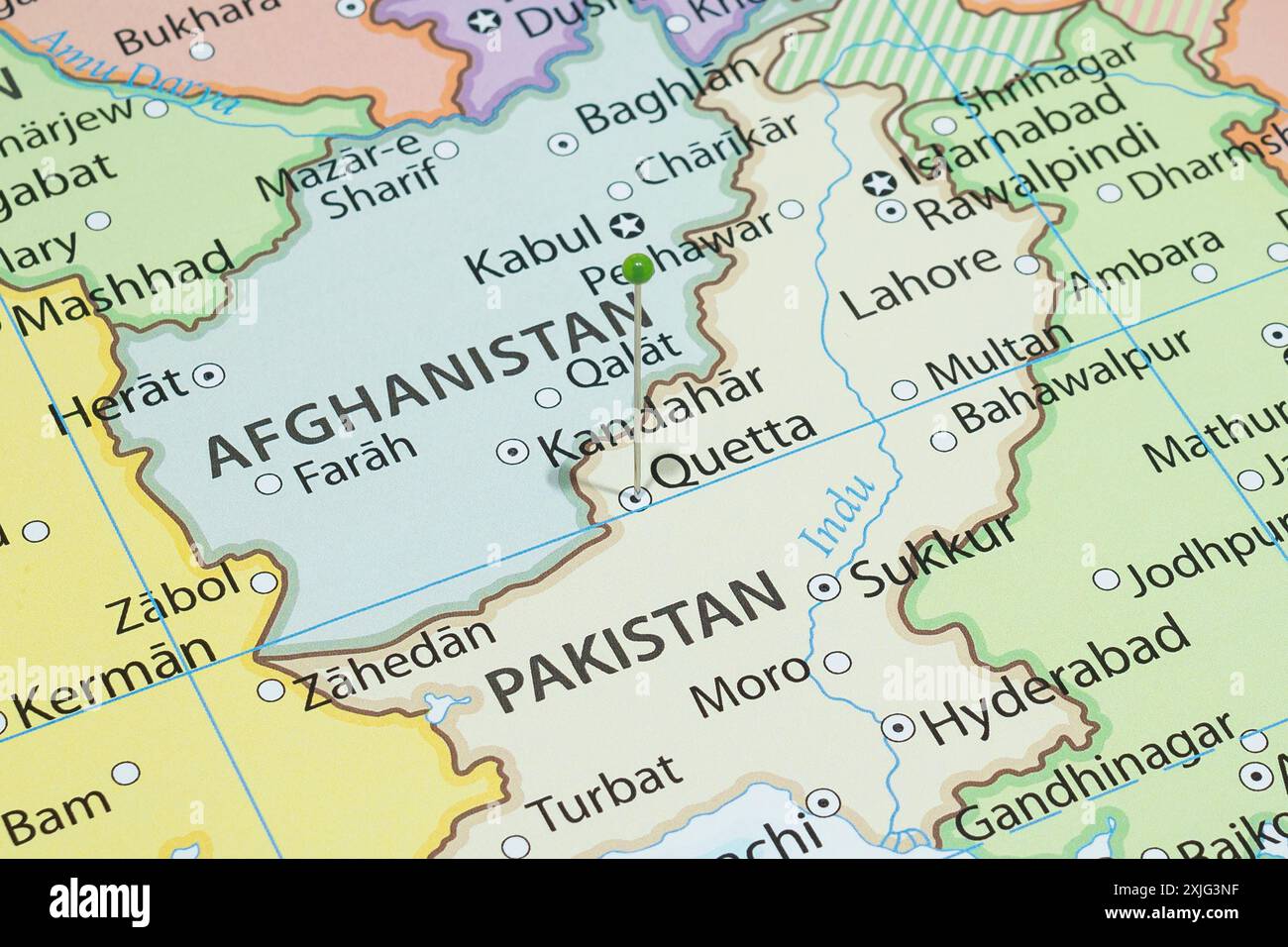 Close up to a Quetta city with a green pin needle into Pakistan country ...