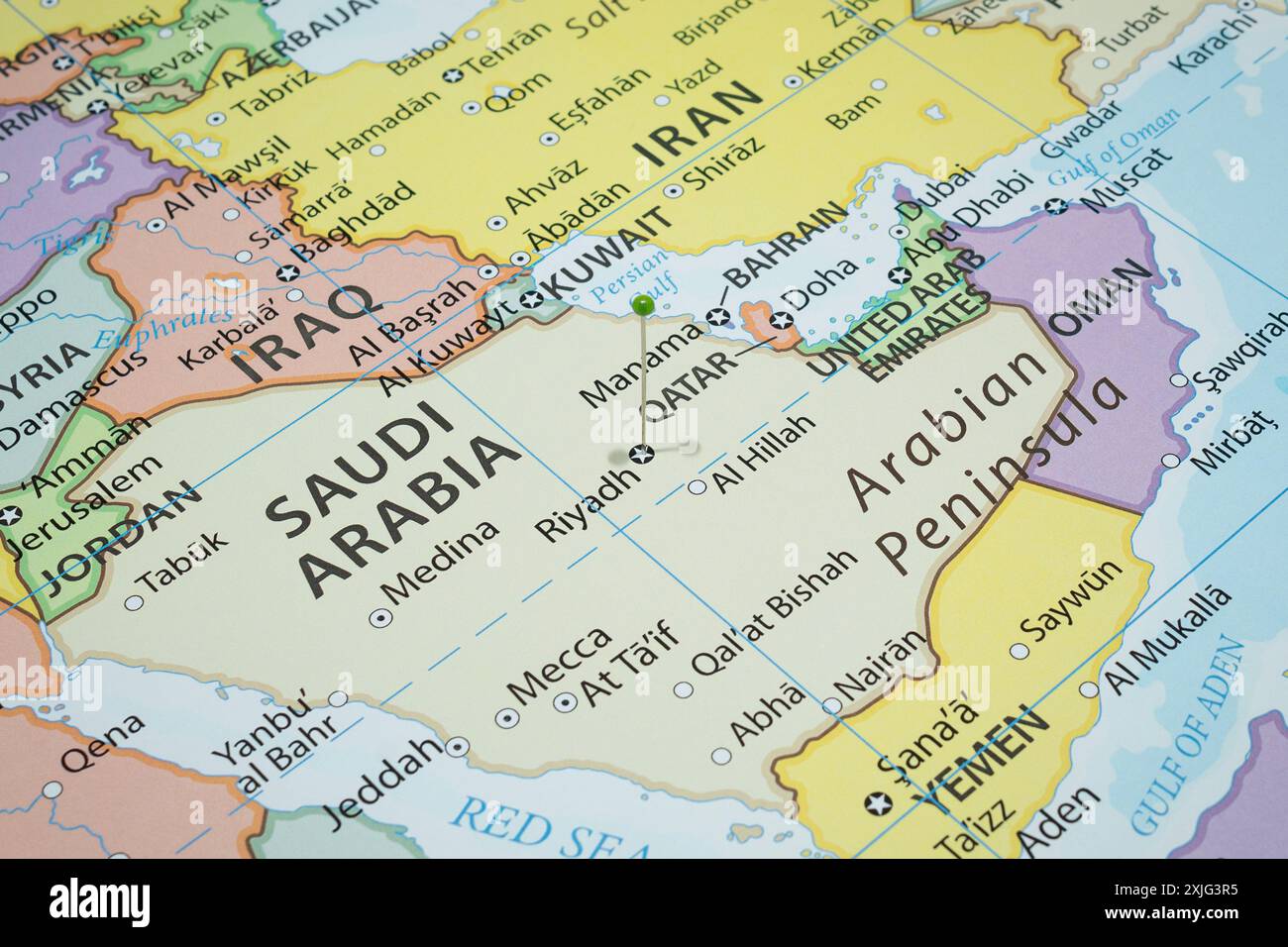 Close up to a Riyadh city with a green pin needle into Saudi Arabia ...