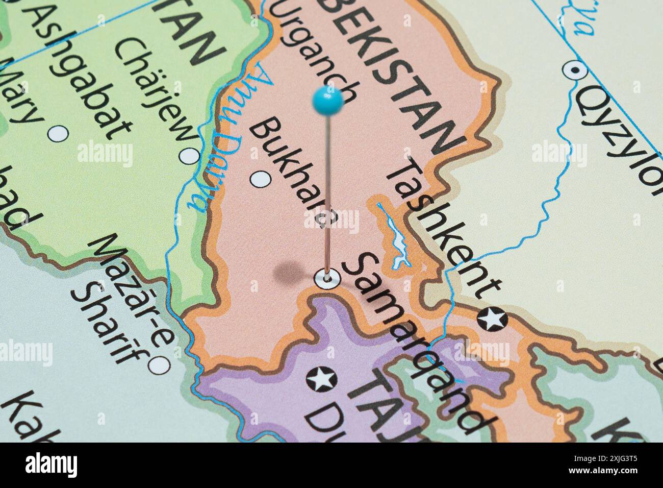 Close up to a Samarkand city with a light blue pin needle into ...