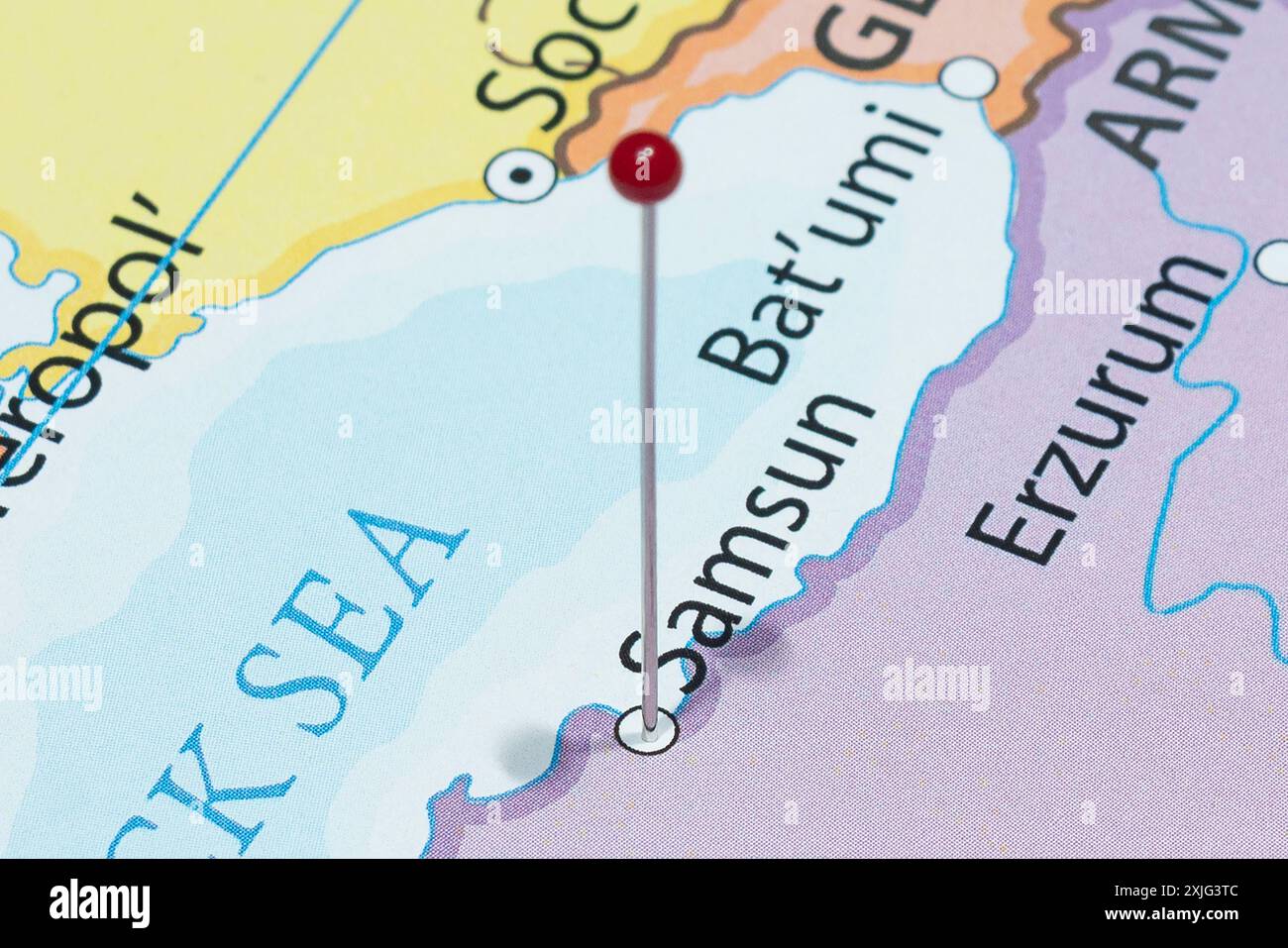 Close up to a Samsun city with a red pin needle into Turkey country ...