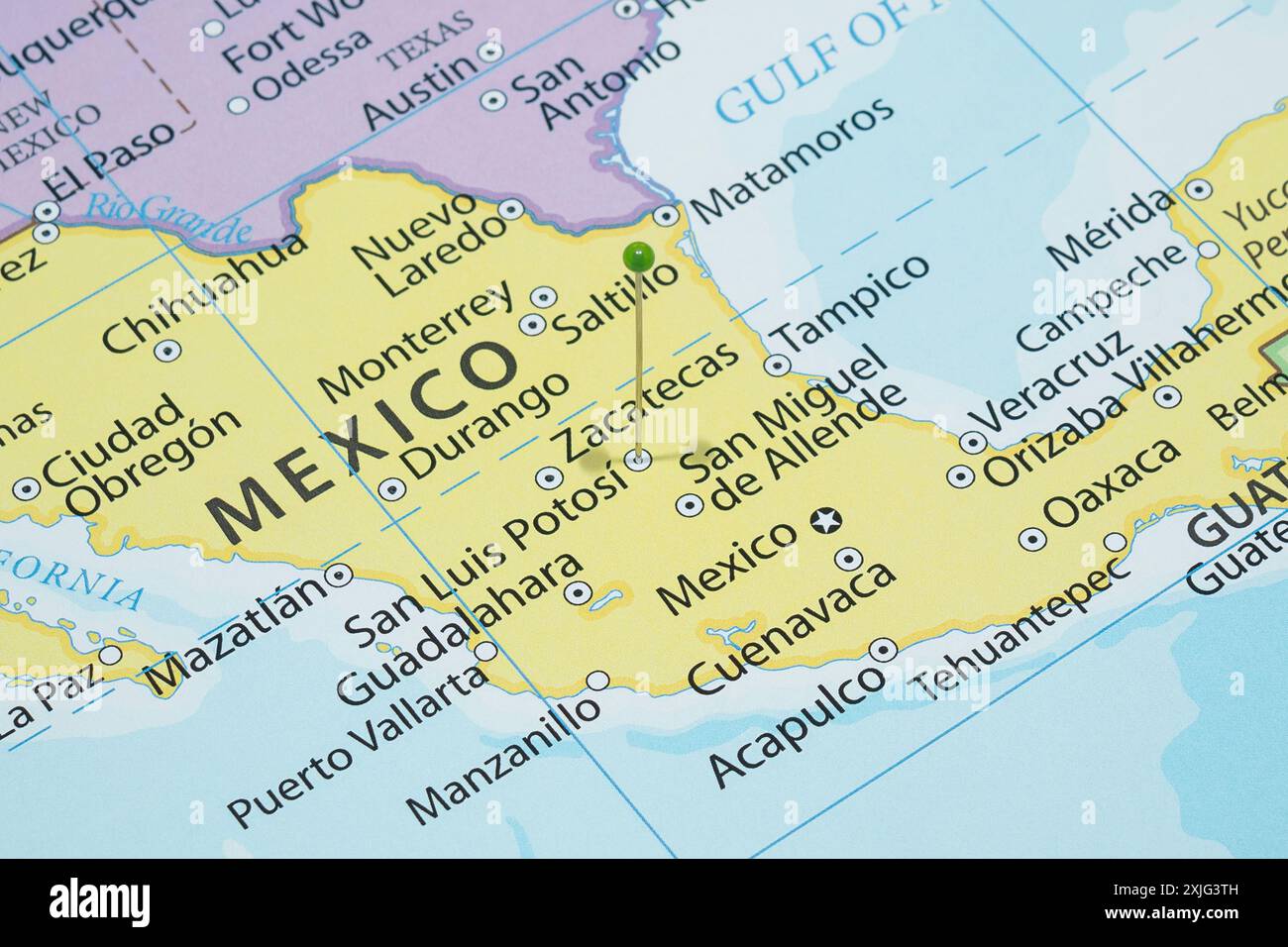 Close up to a San Luis Potosi city with a green pin needle into Mexico ...