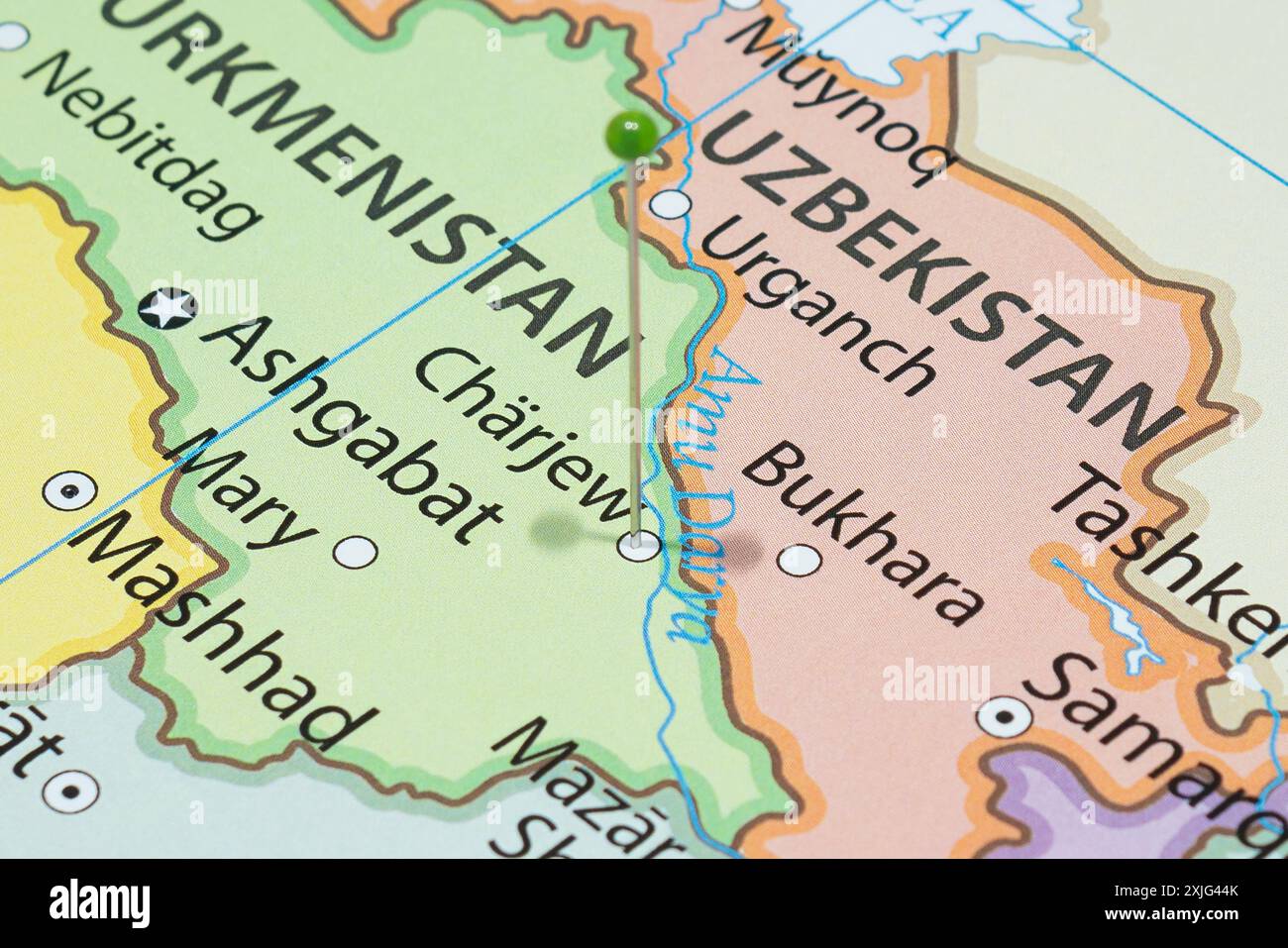 Close up to a Turkmenabat city with a green pin needle into ...