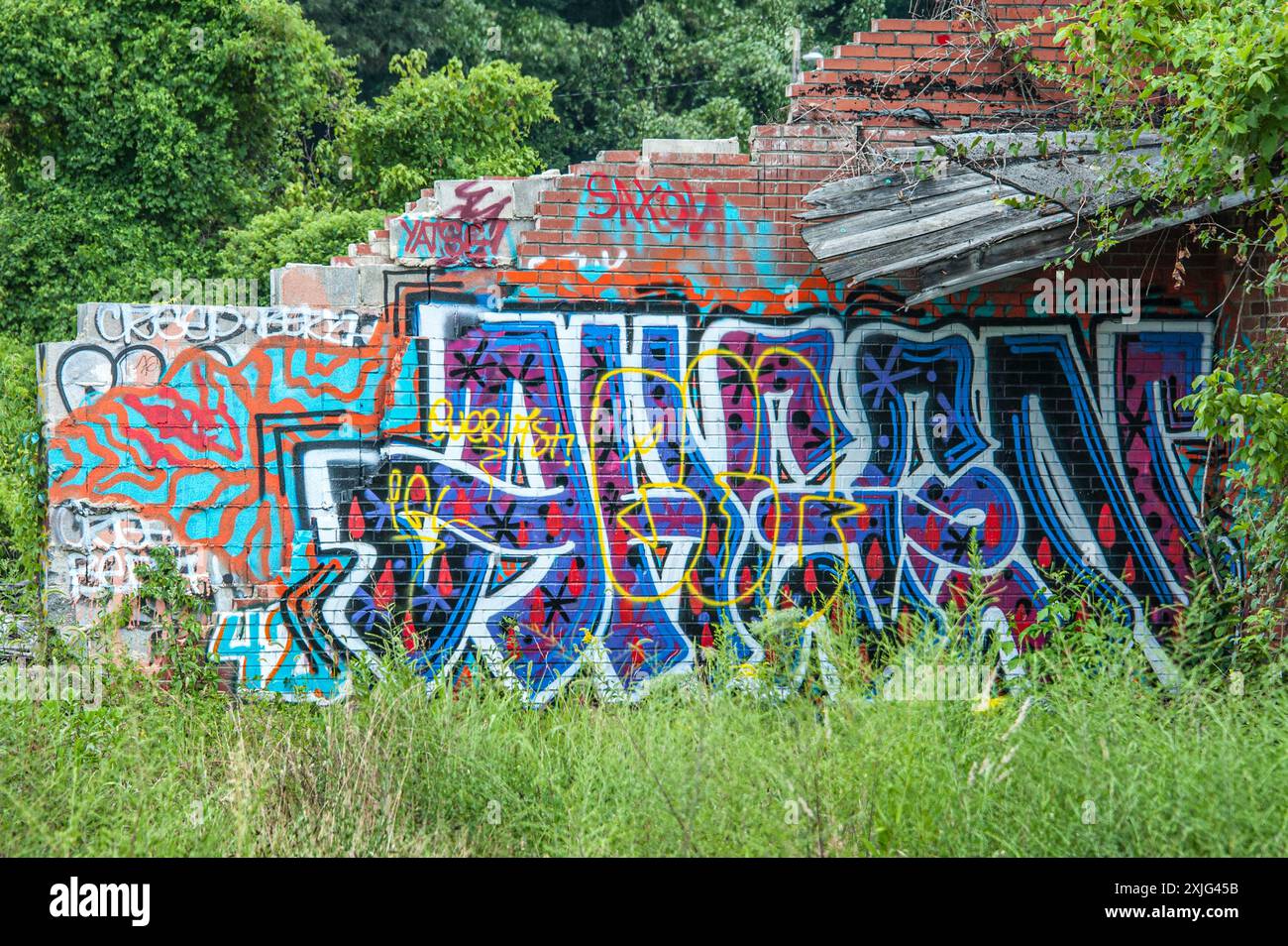 Colorful painted graffiti on an abandoned building in Asheville, North Carolina's River Arts ...