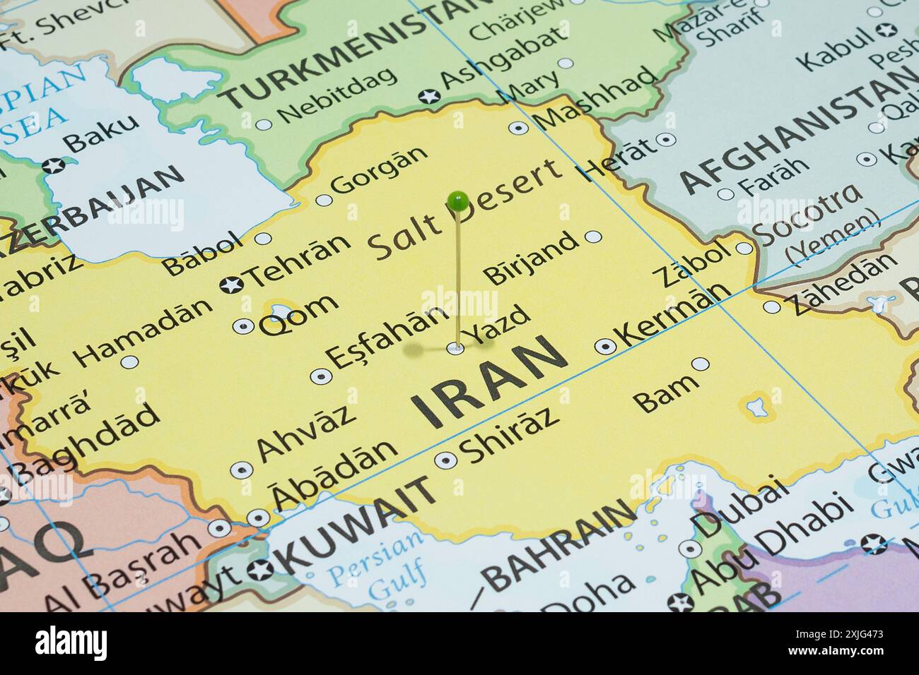 Close up to a Yazd city with a green pin needle into Iran country ...