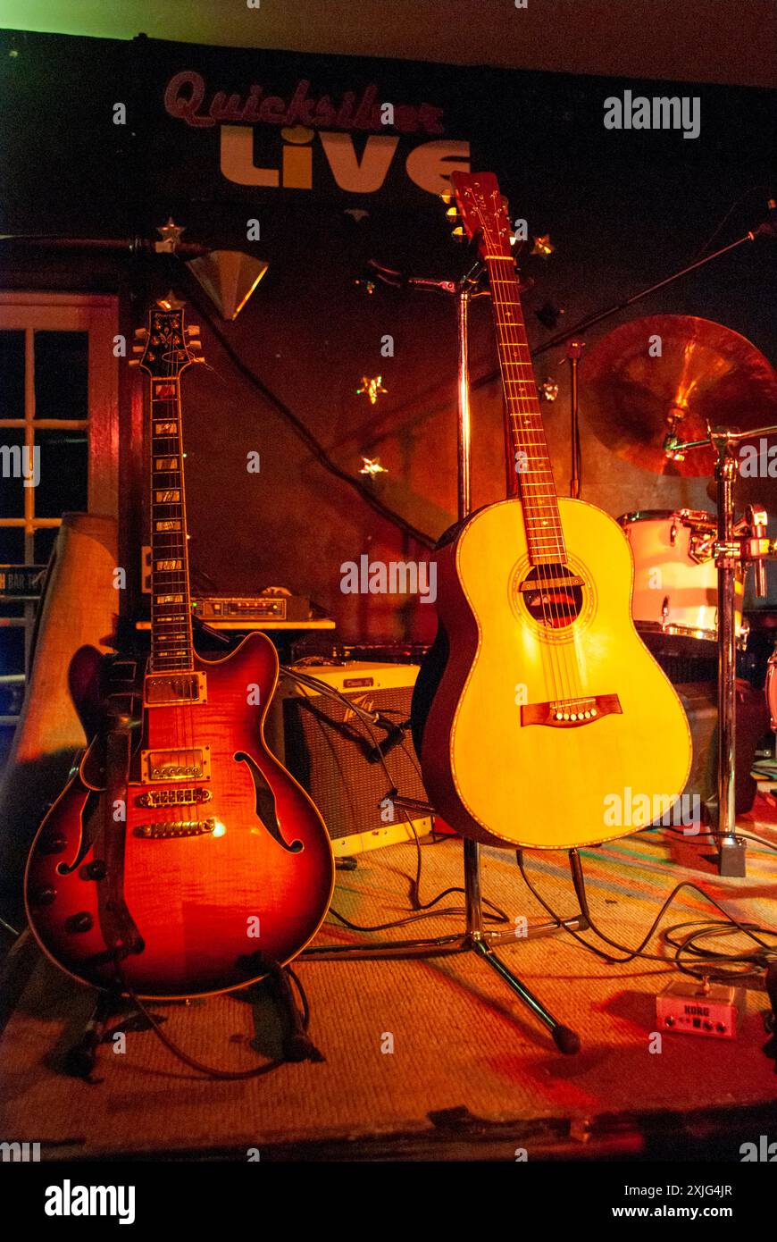 Guitar on stage Stock Photo - Alamy