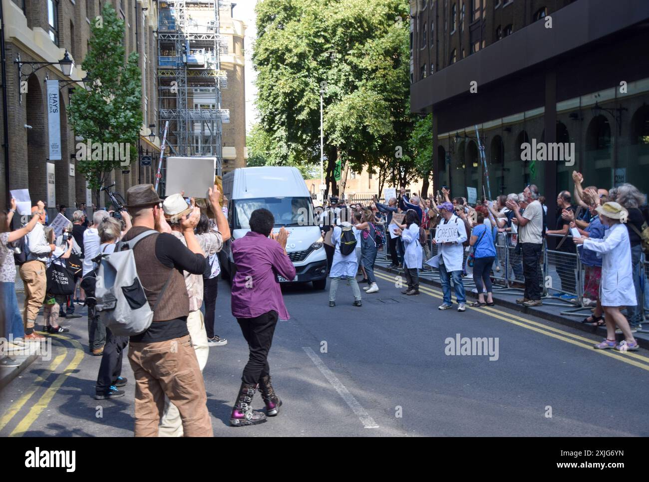 London, UK. 18th July 2024. Protesters show their support as a van ...