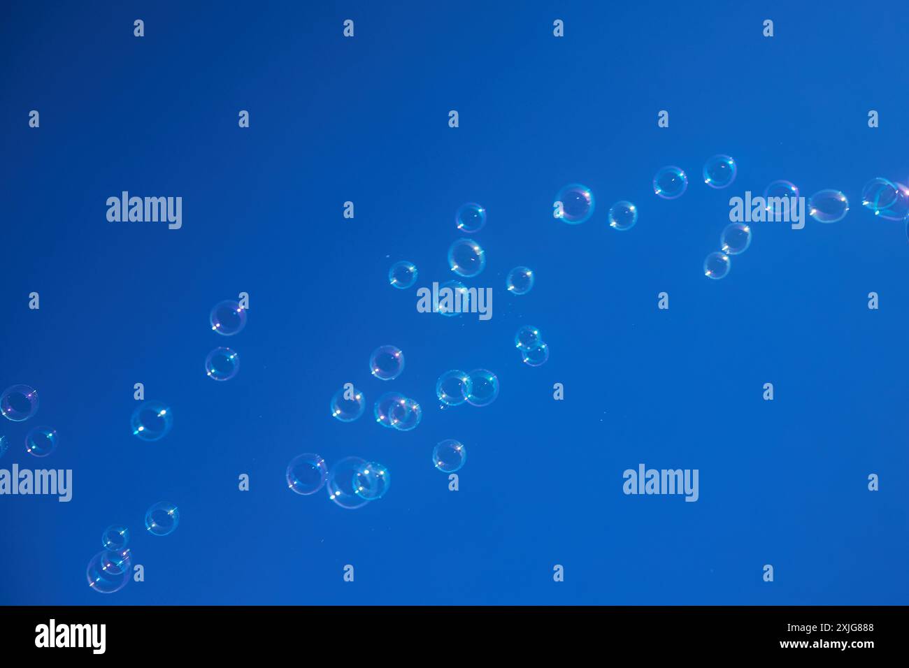 Floating Bubbles in Blue Sky Stock Photo - Alamy