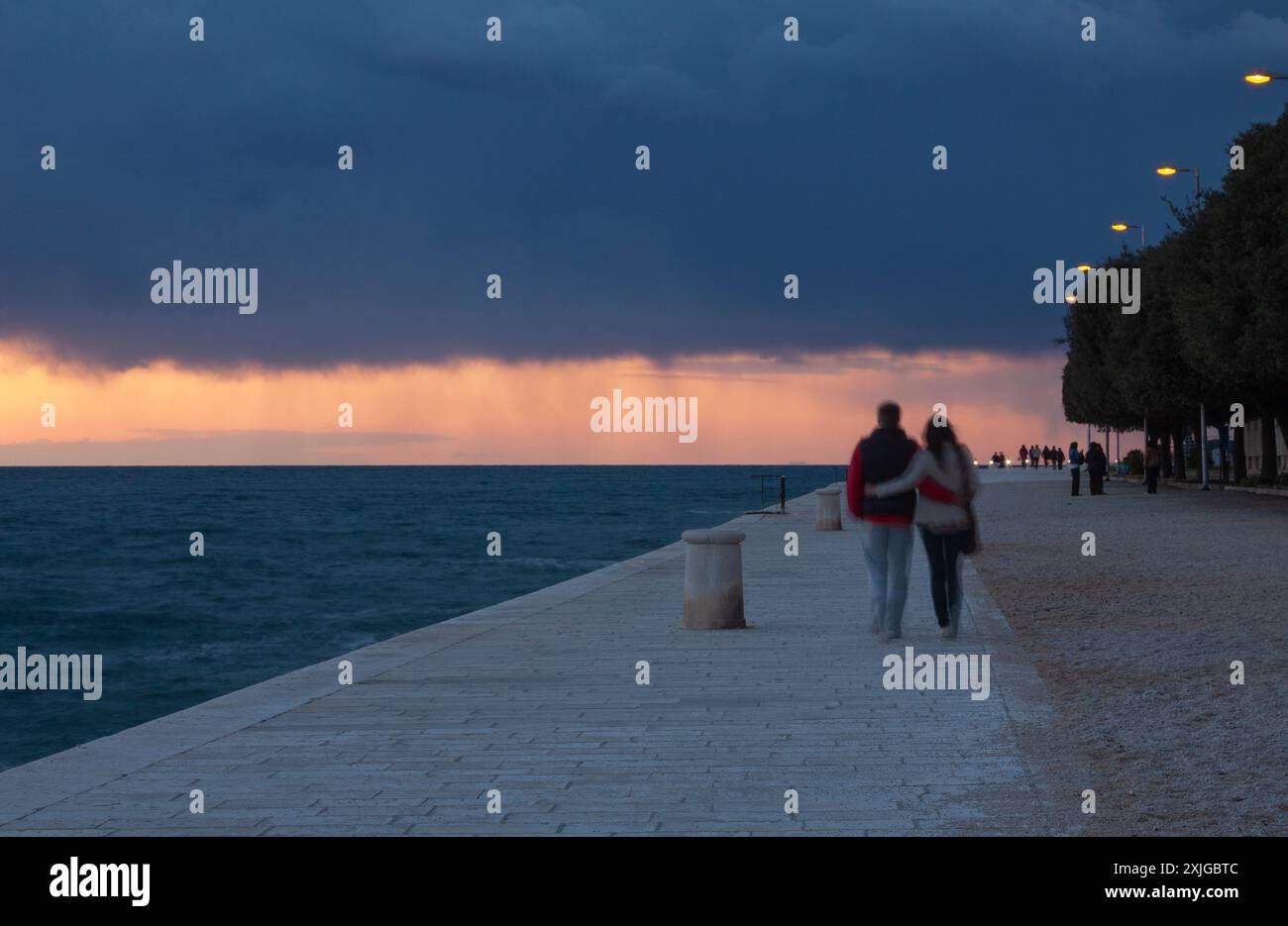 Sunset by the waterfront promenade in Zadar old town in Croatia in ...