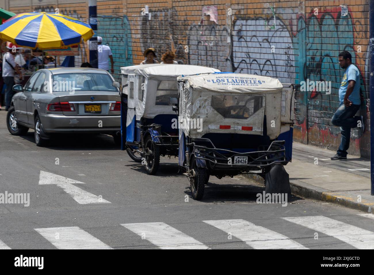 Lima, Peru - March 19, 2019: Motorized rickshaws await passengers Stock ...