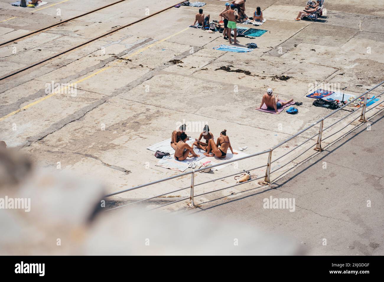 Relaxing on a Concrete Beach in Spain: Urban Coastal Experience Stock ...