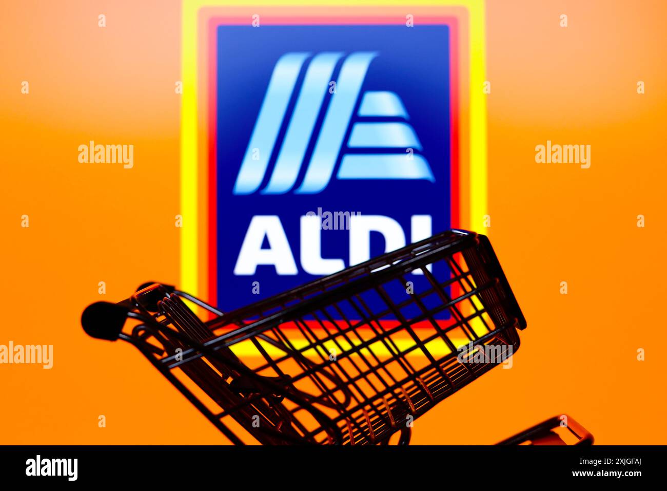 In this photo illustration, a shopping cart is seen in front of the ...