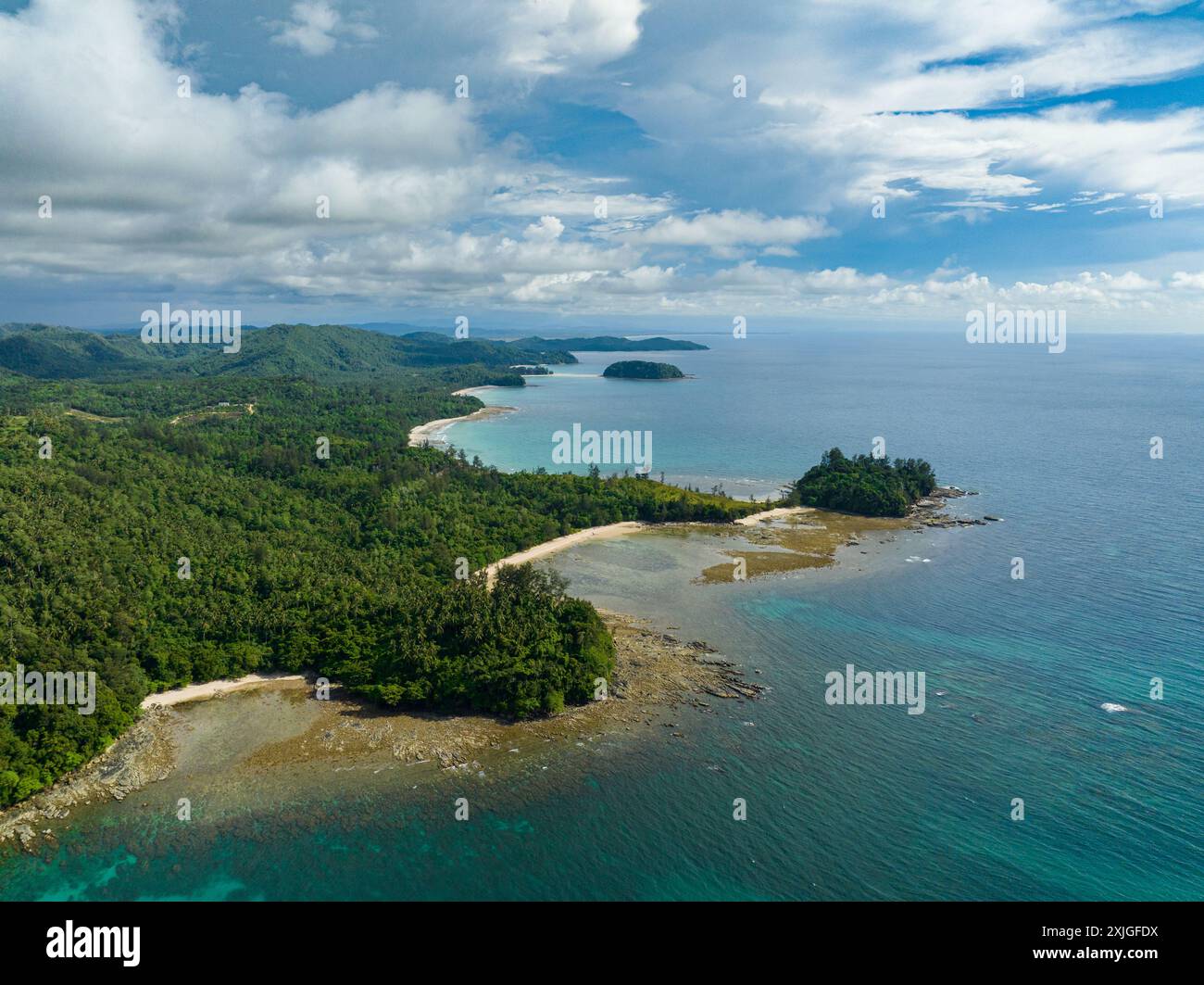 Aerial drone of Borneo island covered with rainforest and sandy beach ...