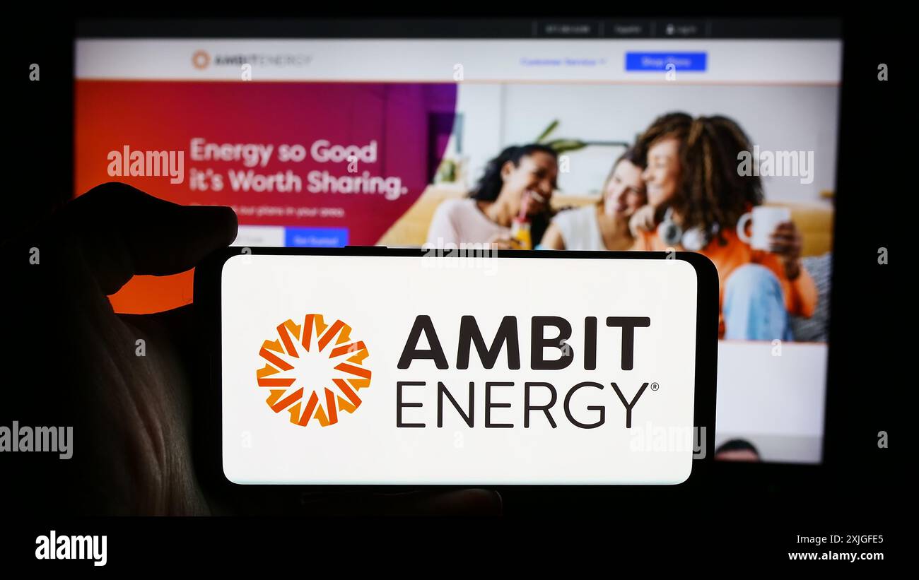 Person holding mobile phone with logo of American multi-level marketing ...