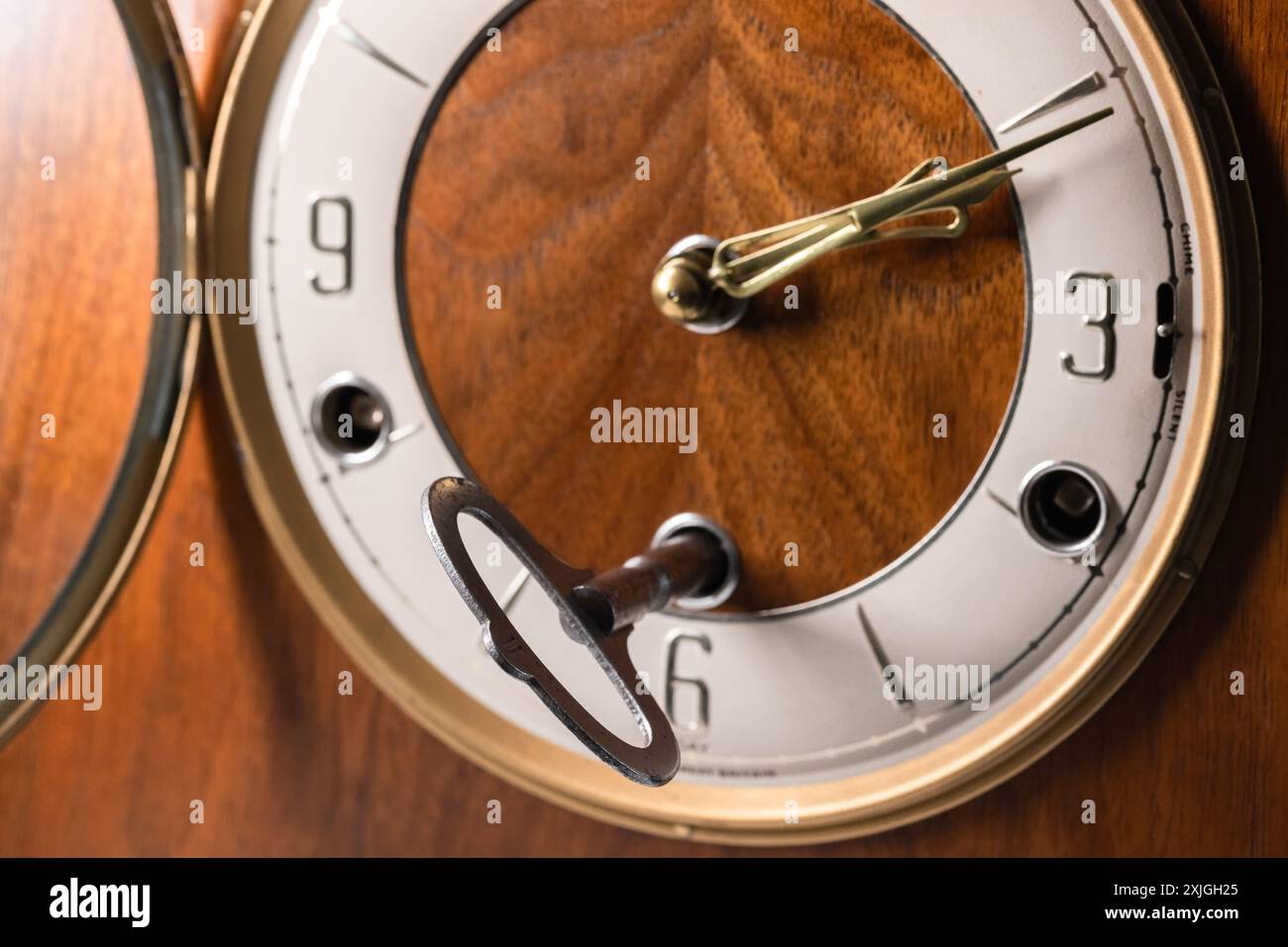 Winding key of vintage chiming mantel clock, close up photo Stock Photo ...