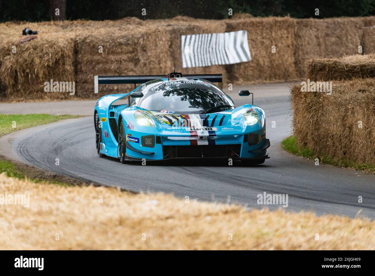 2021 Scuderia Cameron Glickenhaus SCG 004C race car driving up the hill climb track at the ...