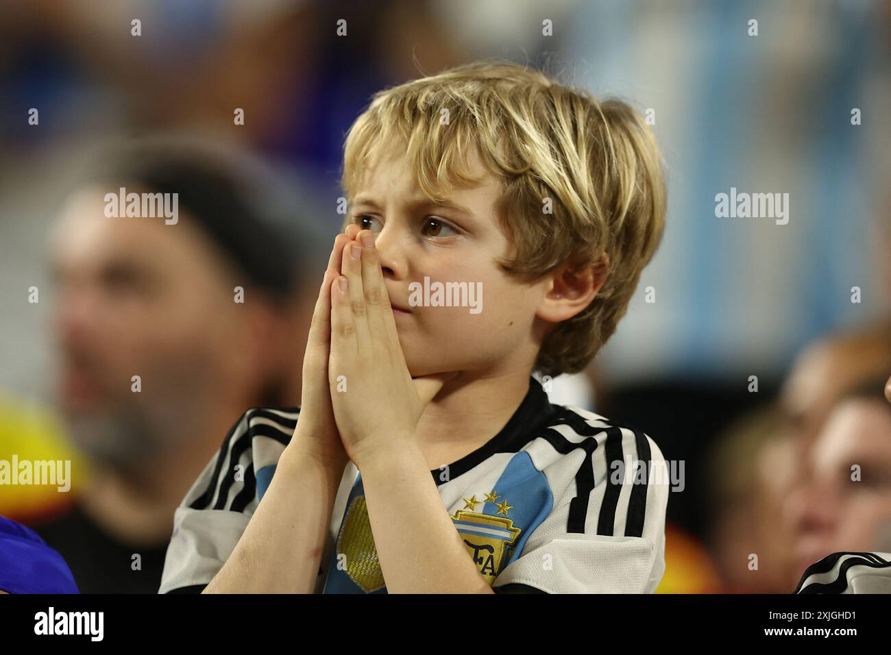 Argentina’s fans watch their team play and show gestures of anguish and ...