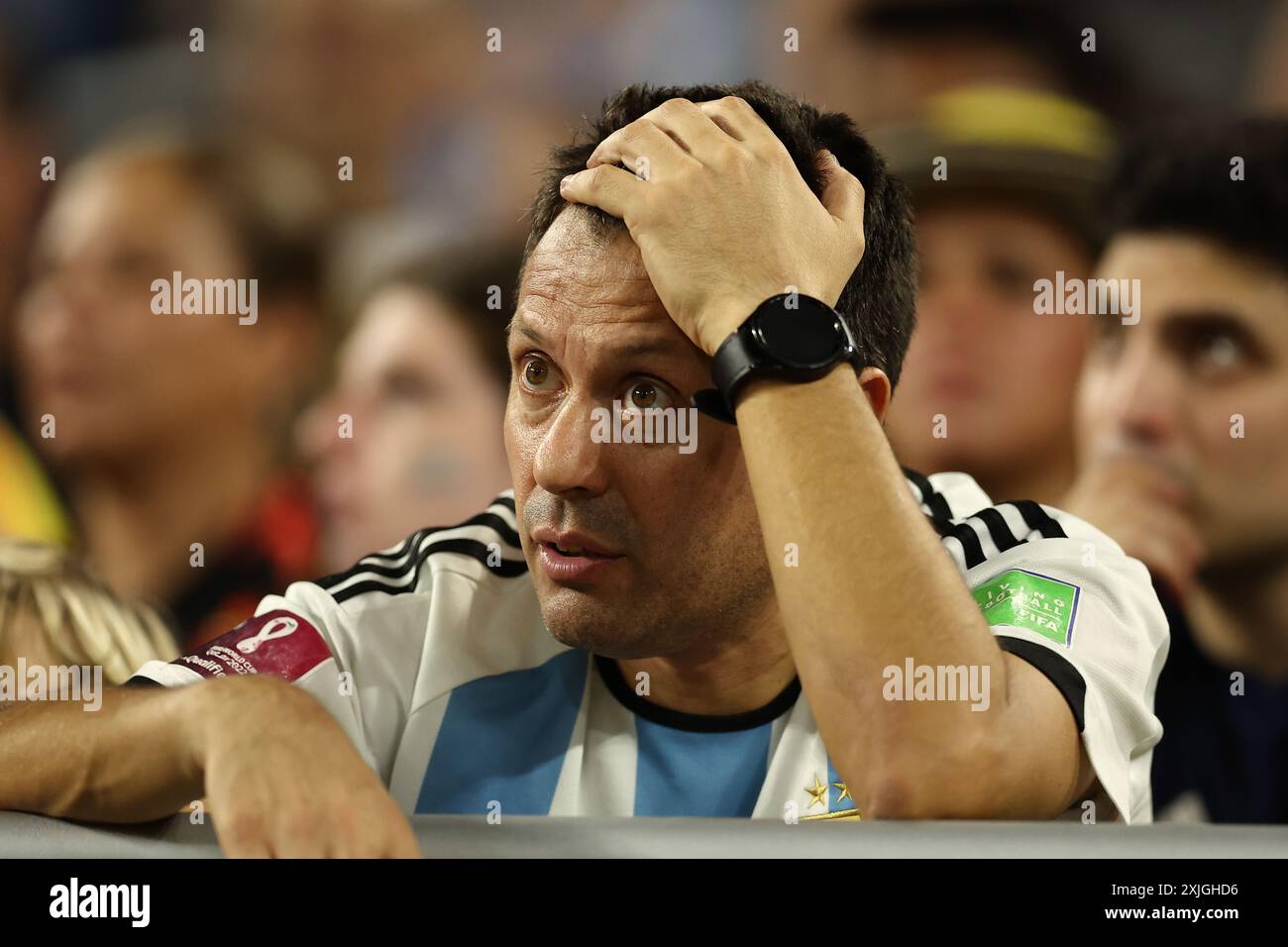 Argentina’s fans watch their team play and show gestures of anguish and ...