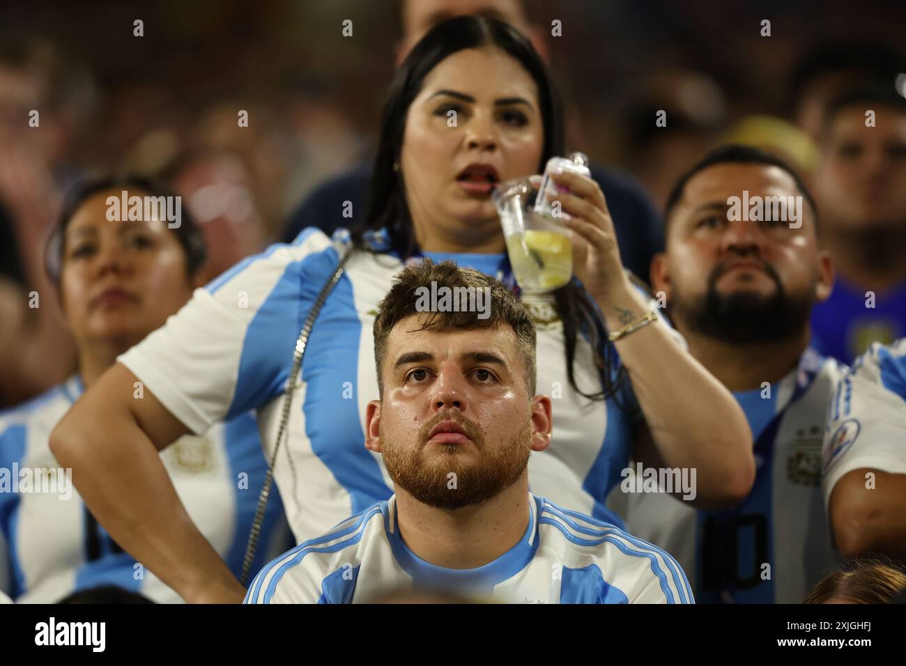 Argentina’s fans watch their team play and show gestures of anguish and ...