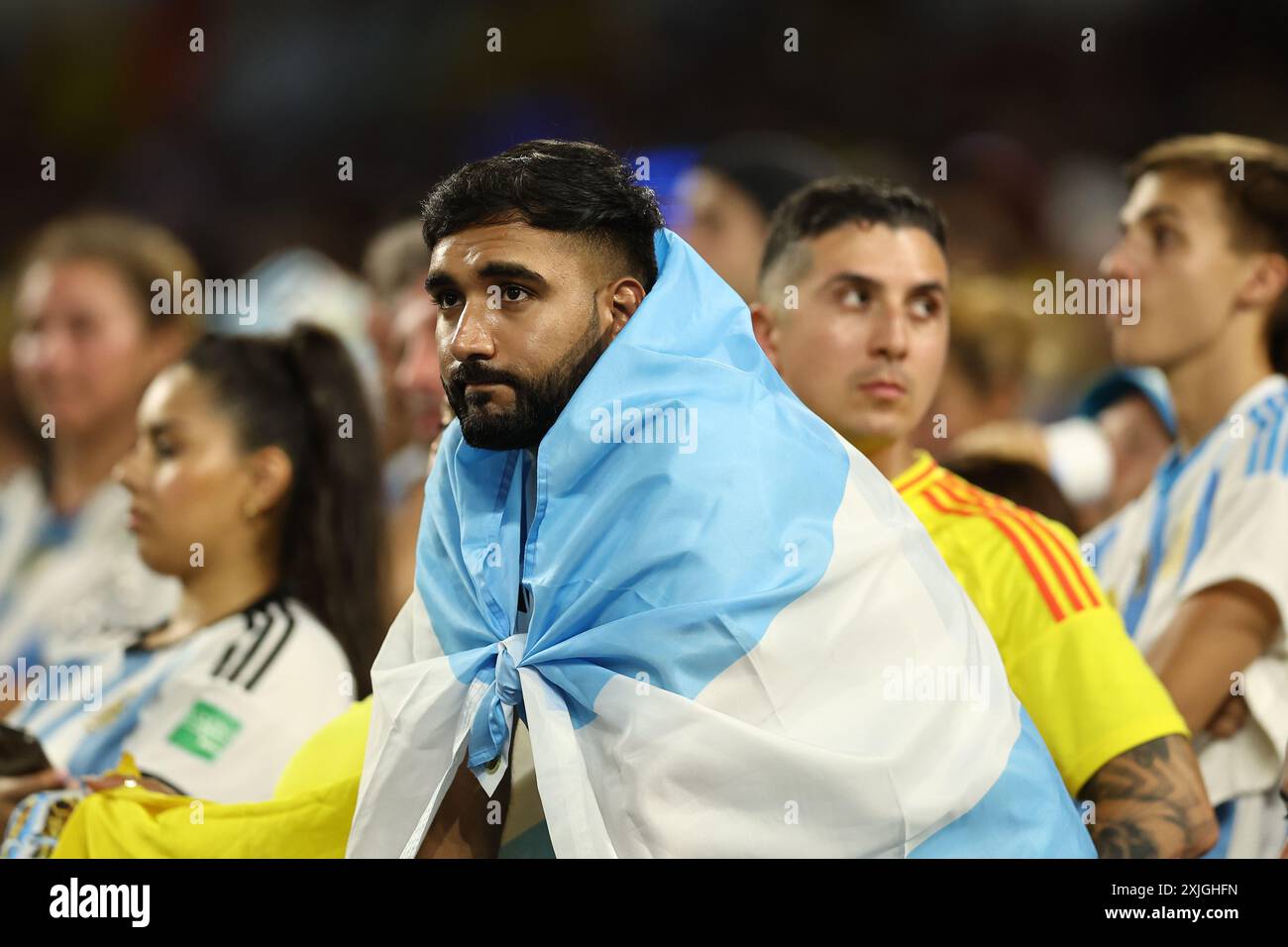 Argentina’s fans watch their team play and show gestures of anguish and ...