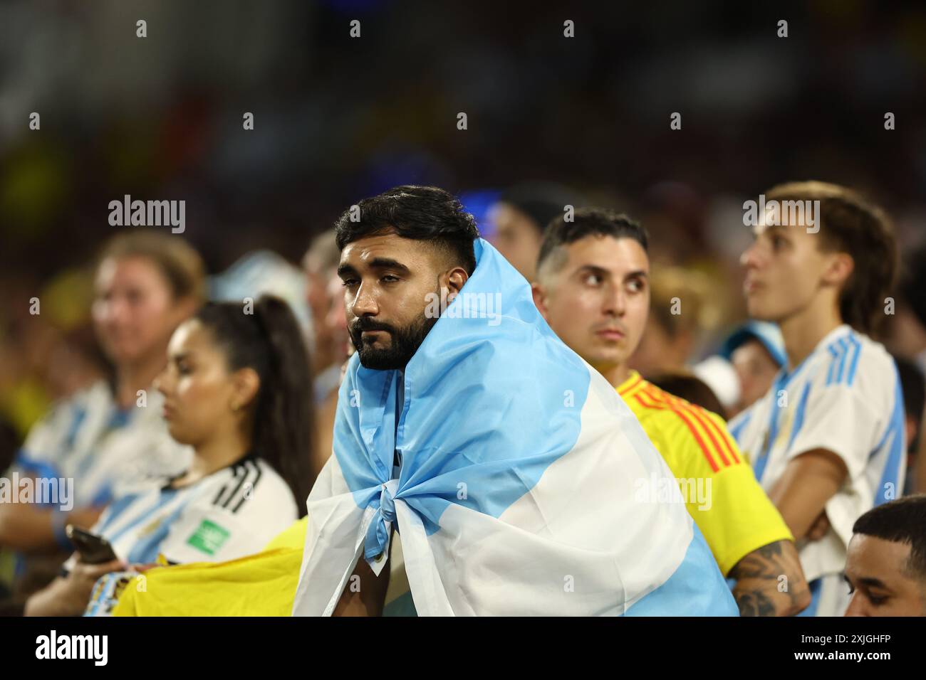 Argentina’s fans watch their team play and show gestures of anguish and ...