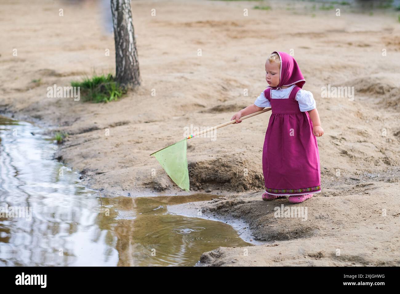 portrait of a little girl with big eyes in Masha's costume from the ...