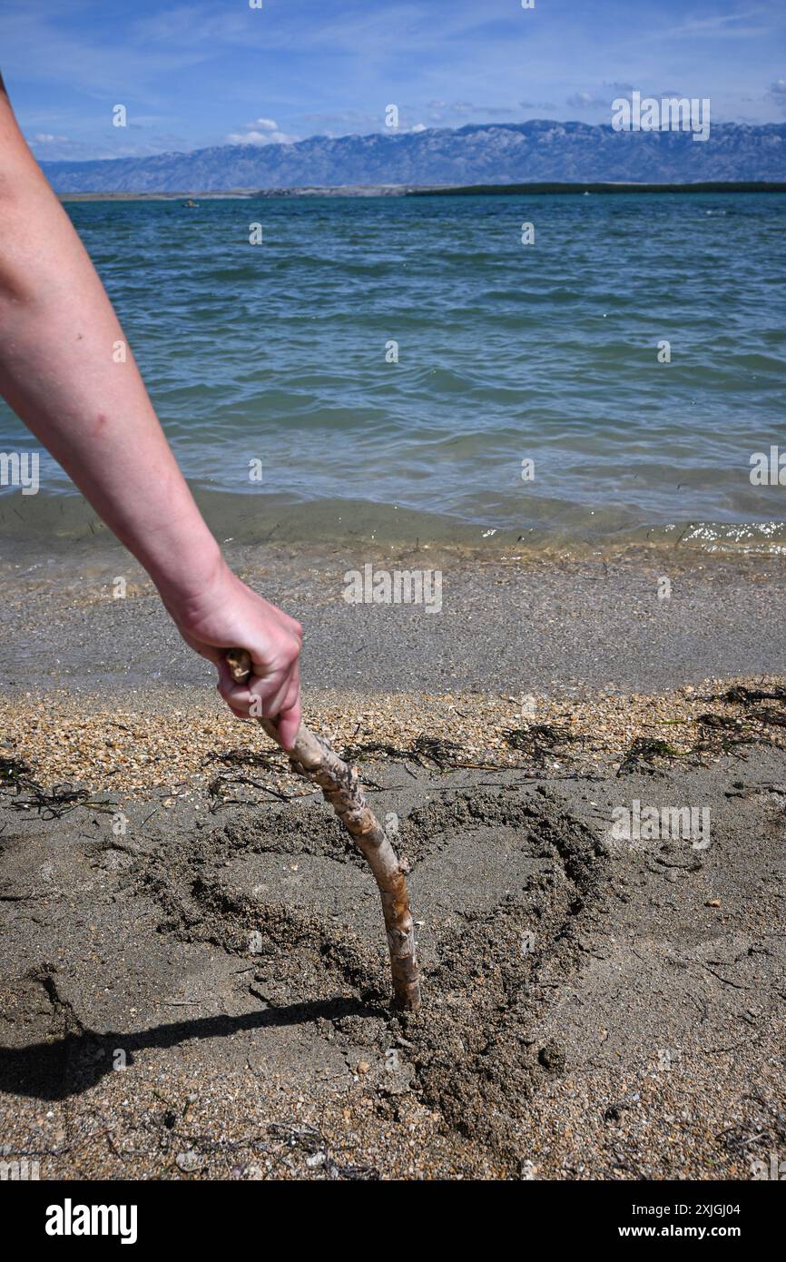 Stick drawing in the sand hi-res stock photography and images - Alamy