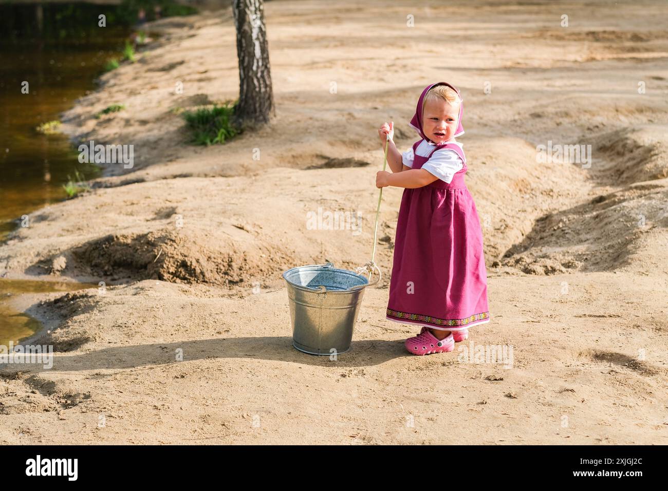 portrait of a little girl with big eyes in Masha's costume from the ...