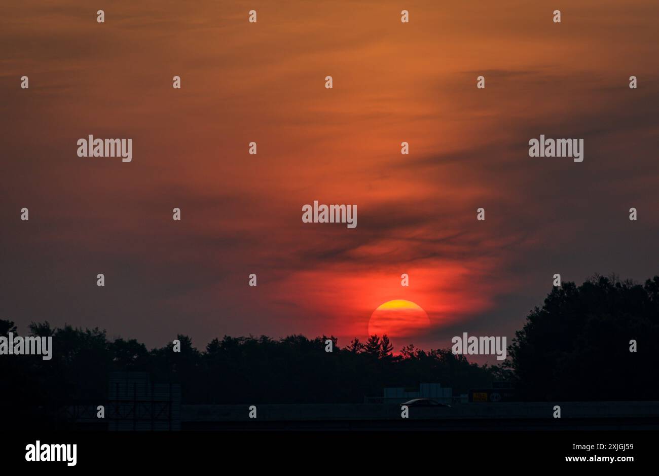 Sunrise captured through hazy clouds Stock Photo - Alamy