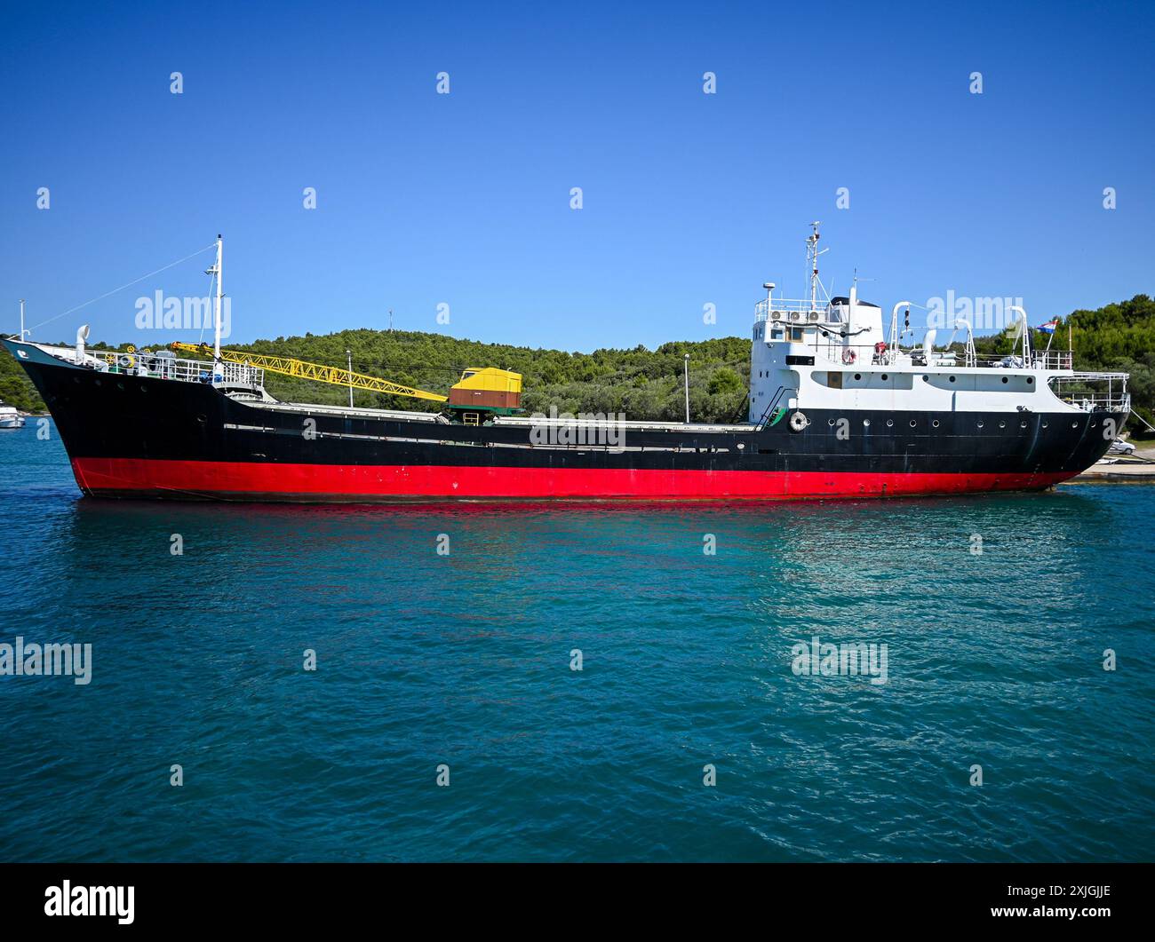 Calm ocean on a sunny day with container ship hi-res stock photography ...