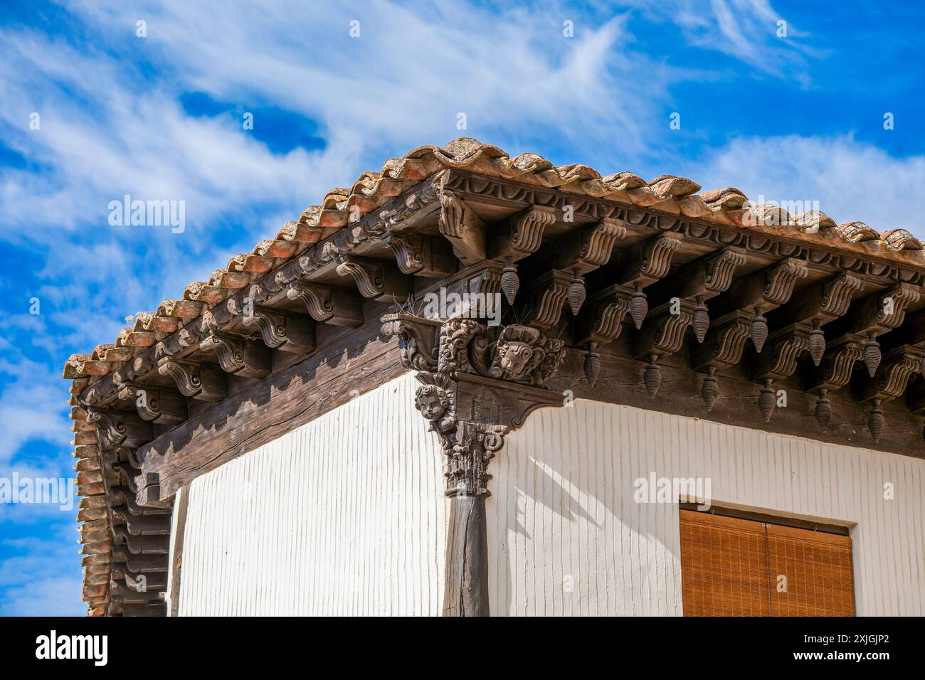 Architectural detail of a carved wooden cornice with many details and a ...