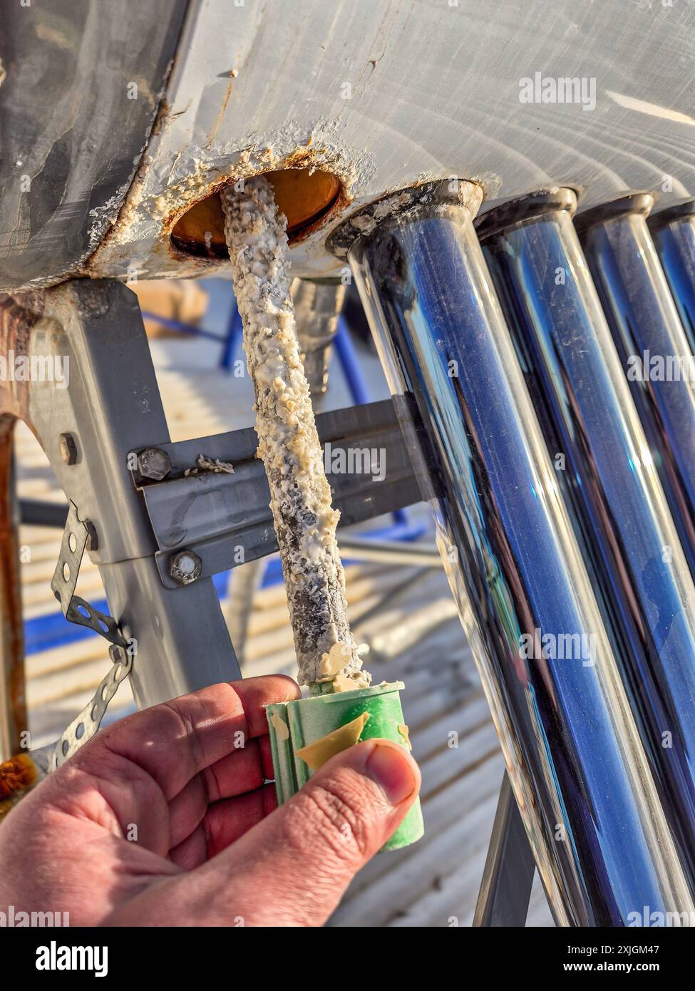 Sacrificial anode in solar hot water tank Stock Photo - Alamy