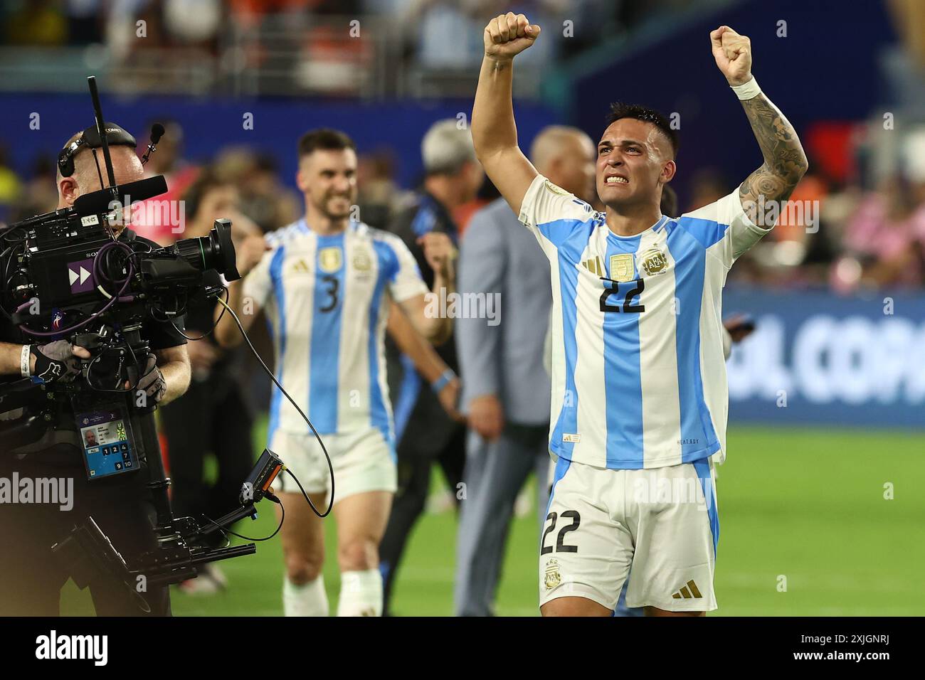 Argentina's forward Lautaro Martinez (R) celebrates after the Copa ...