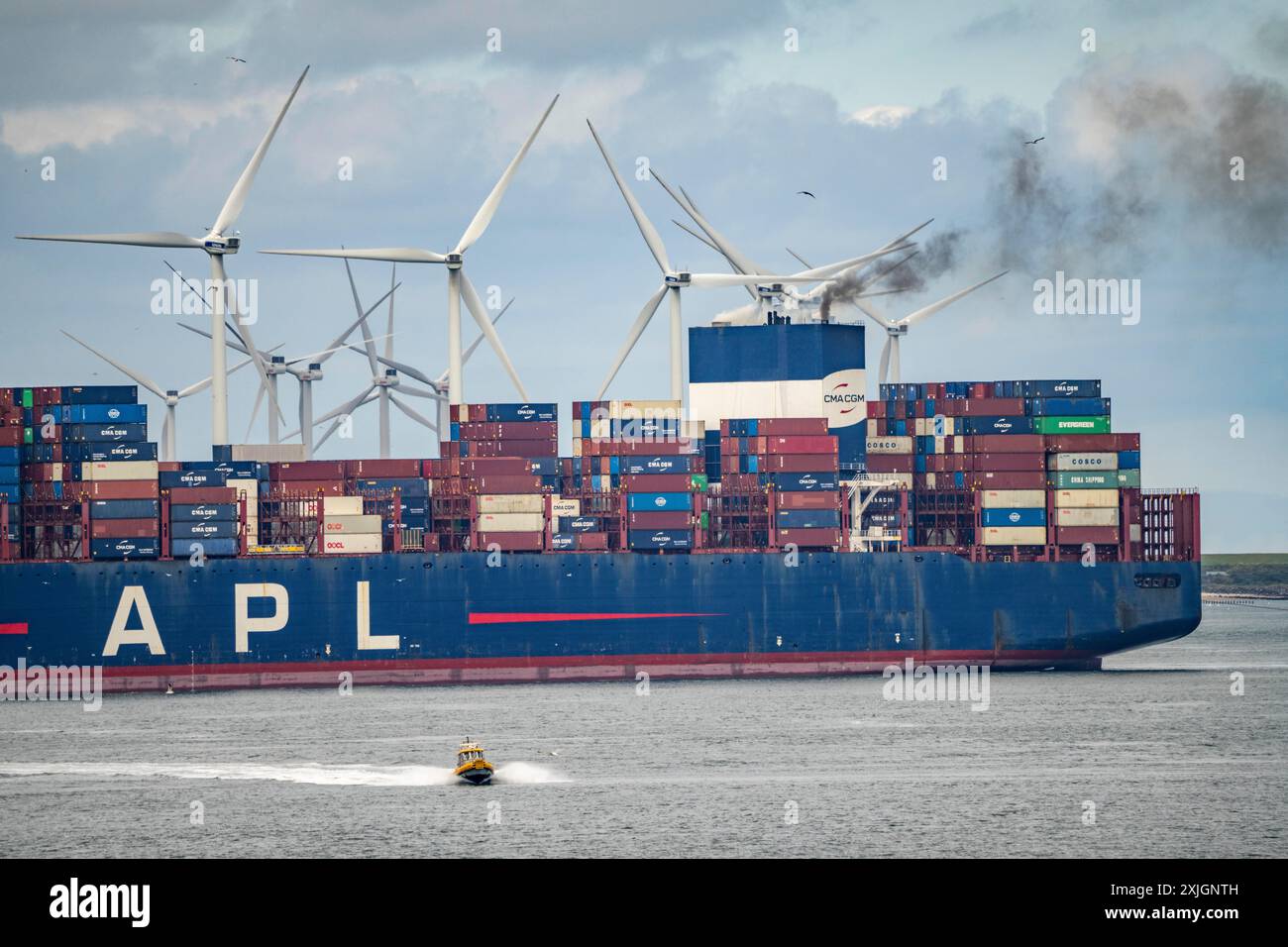 Entrance to the seaport of Rotterdam, APL Raffles container freighter ...