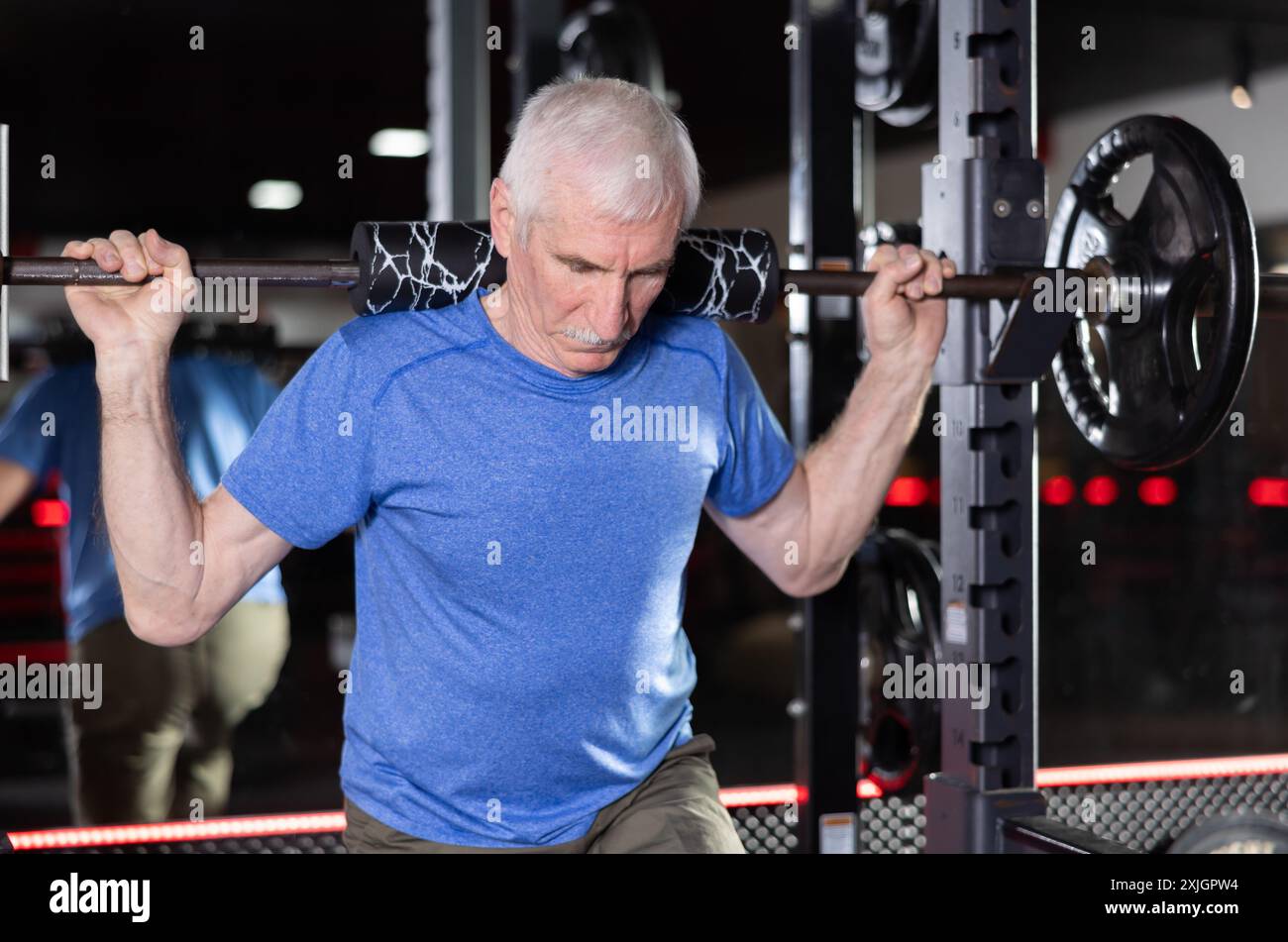 Active man during exercises to strengthen muscles of hands and body ...