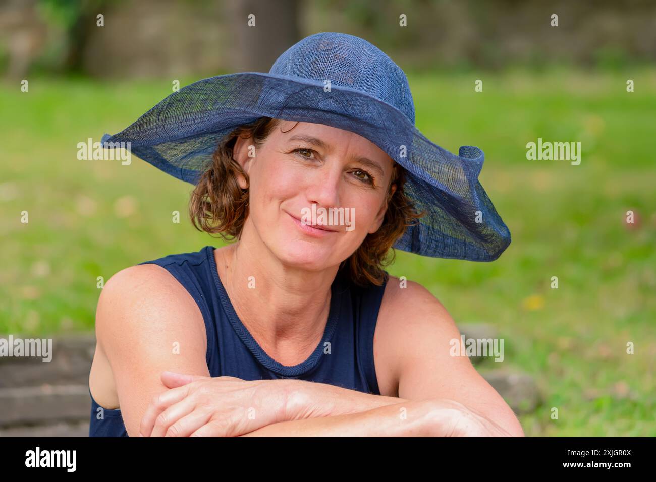 portrait of a romantic elderly woman 50-55 years old in a blue lady's ...