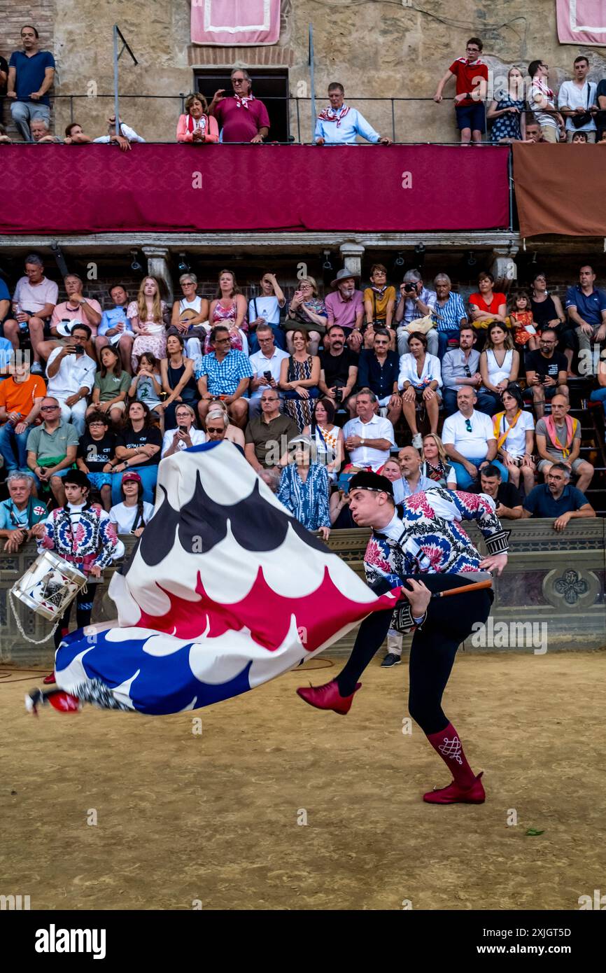 Young Men of The Istrice Contrada Put On A Flag Waving and Throwing ...