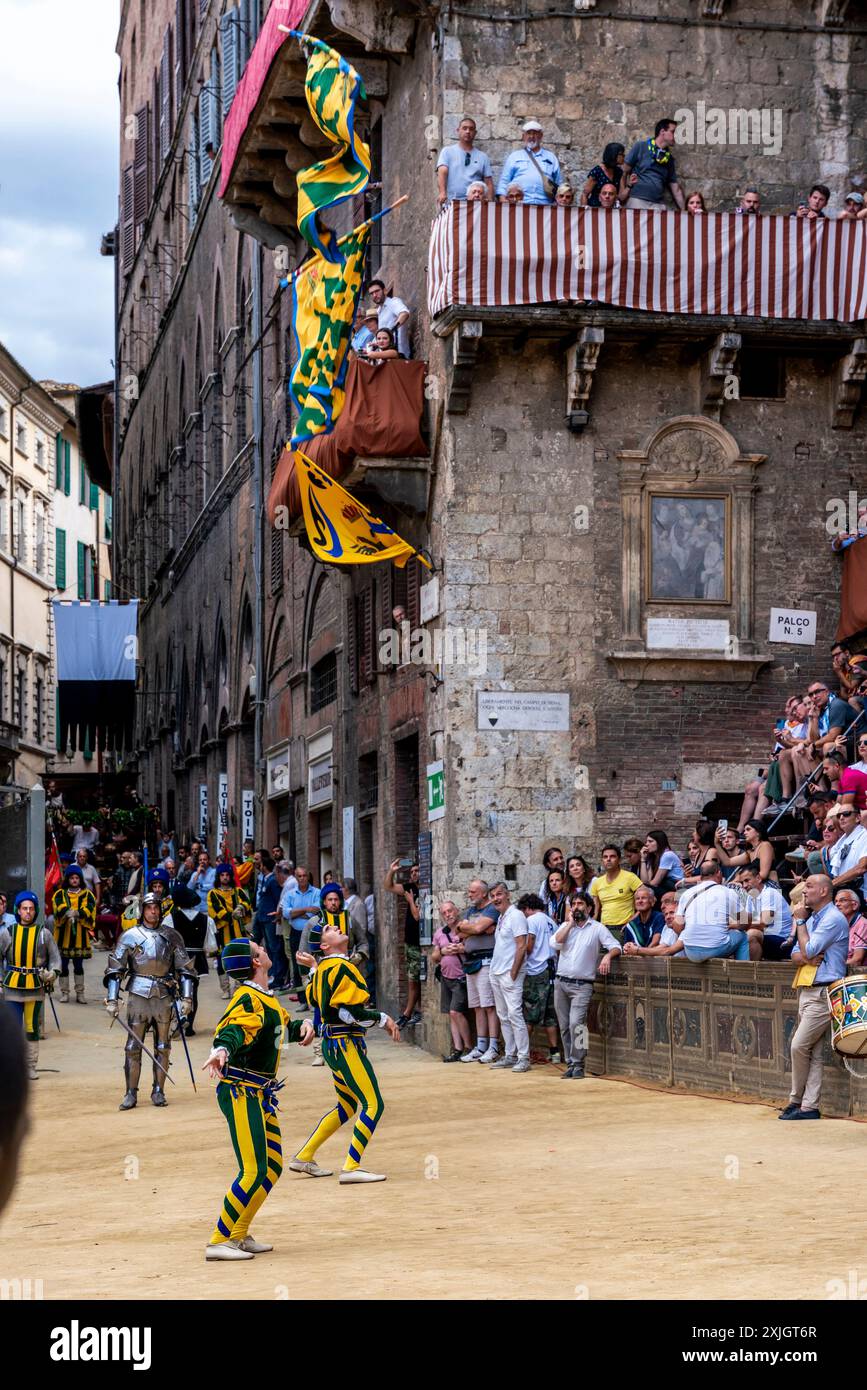 Members of The Bruco Contrada Dressed In Medieval Costume Put On A Flag ...