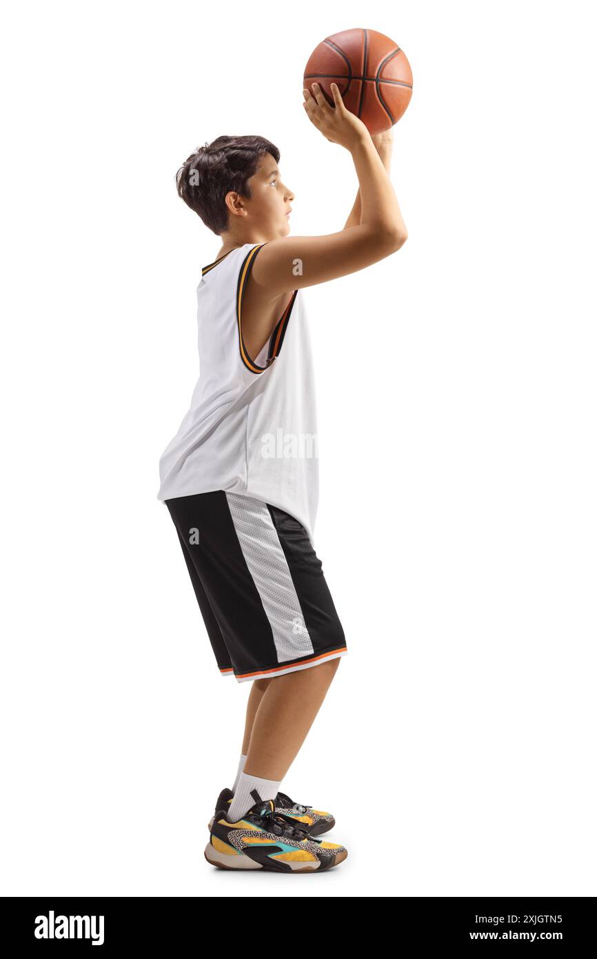 Teenage boy shooting a basketball isolated on white background Stock ...