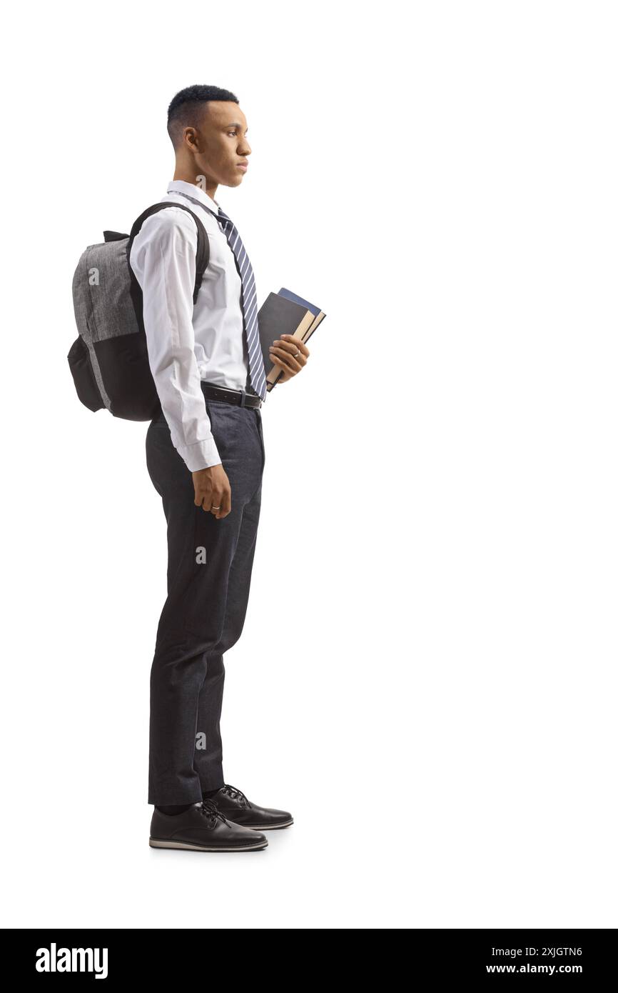 Full length profile shot of an african american student holding books ...