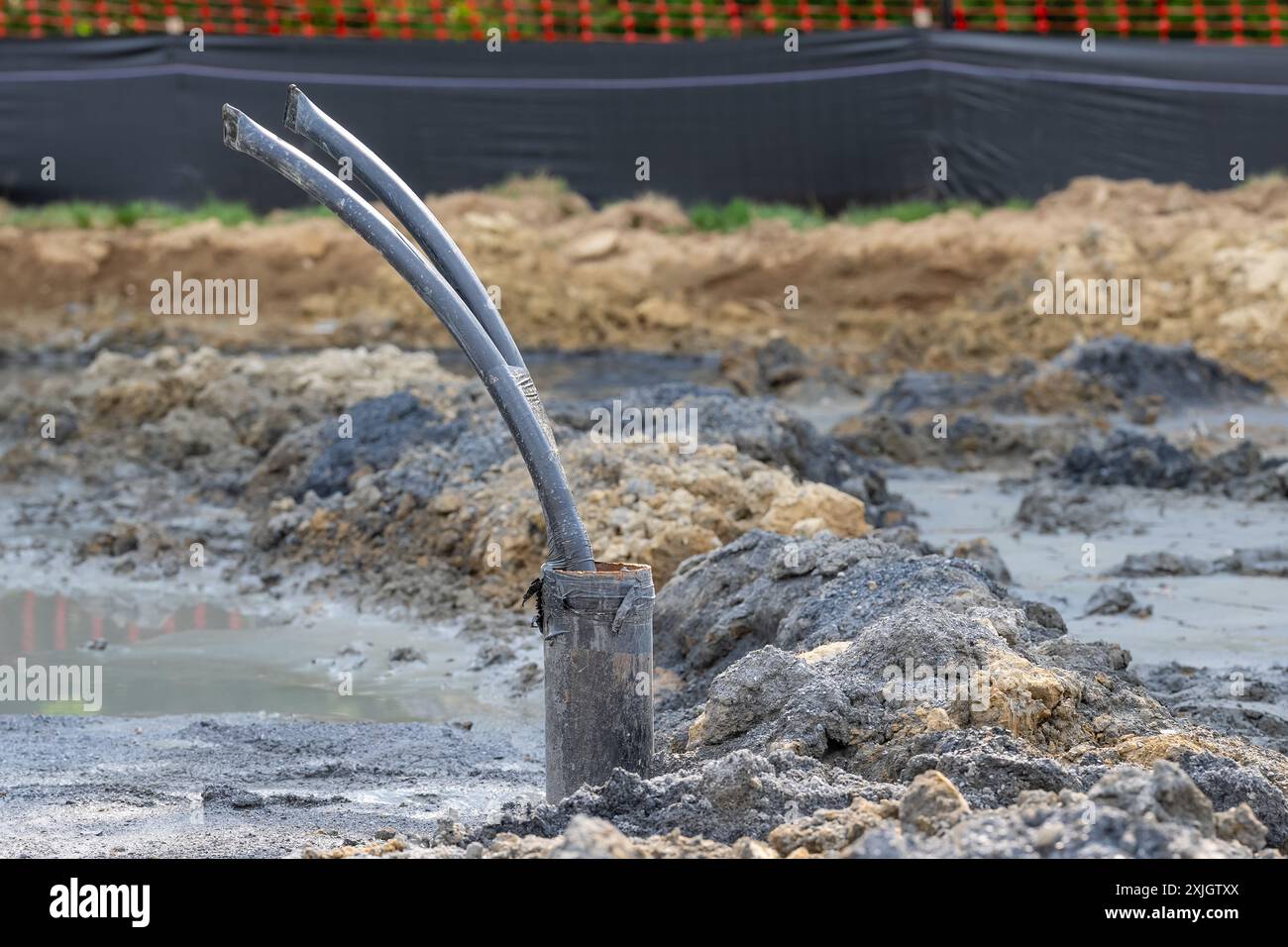 Casing pipe with polyethylene ground loop pipes in the process of being ...