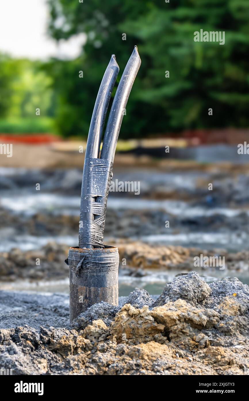 Vertical image of a casing pipe with polyethylene ground loop pipes in ...