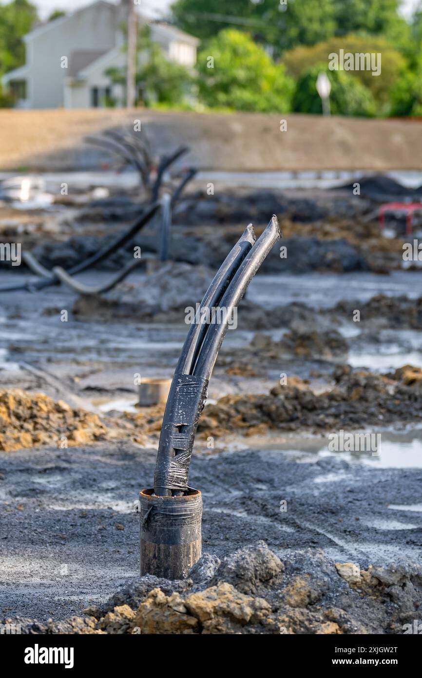 Vertical image of a casing pipe with polyethylene ground loop pipes in ...