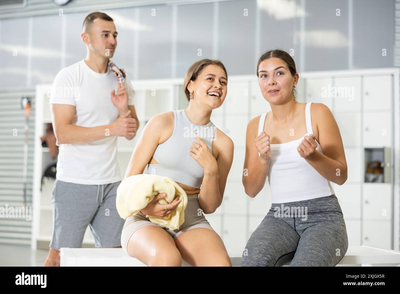 Young man intervenes in conversation between two girls in dressing room ...